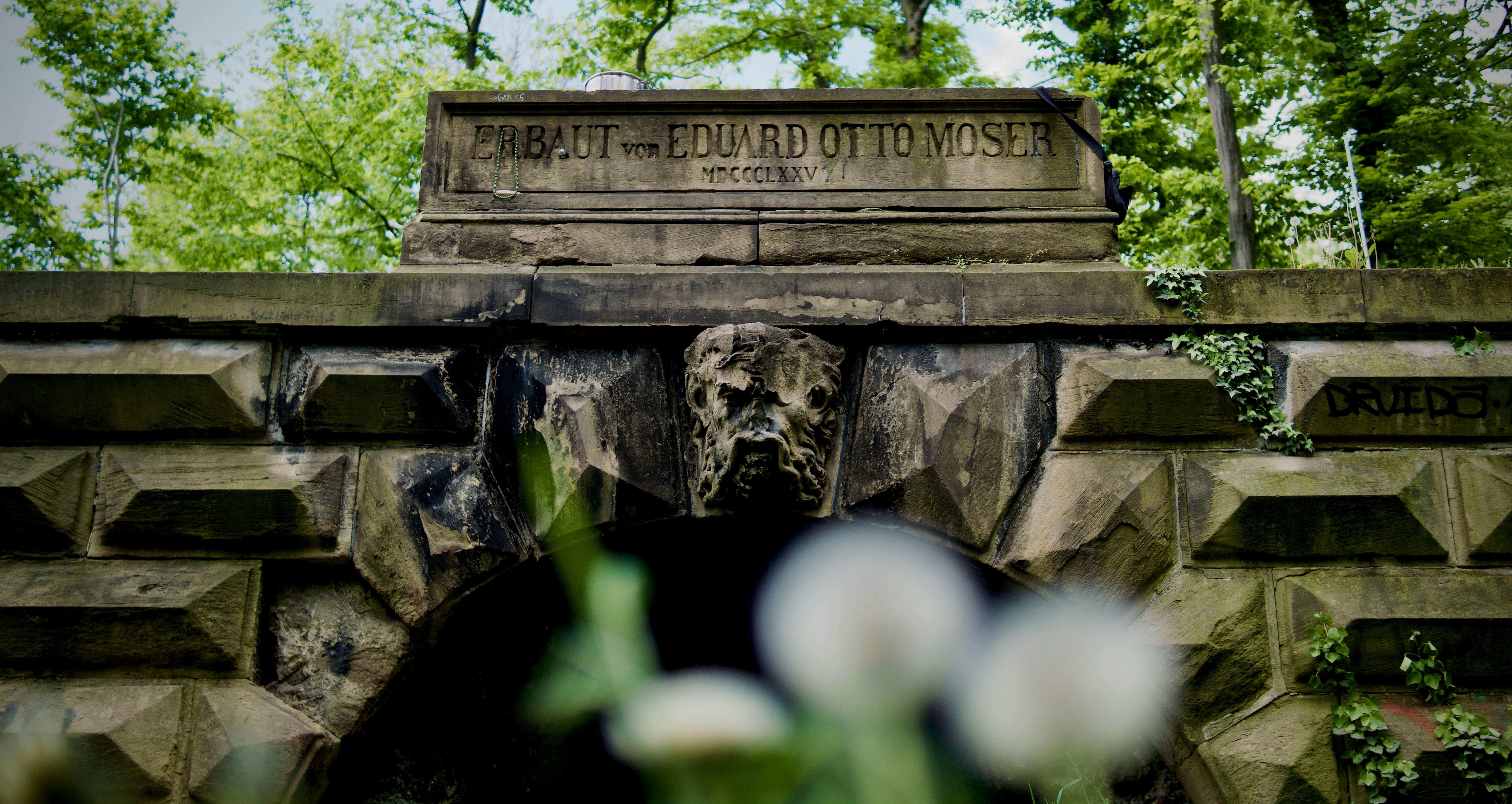 a stone bridge with a sign on it