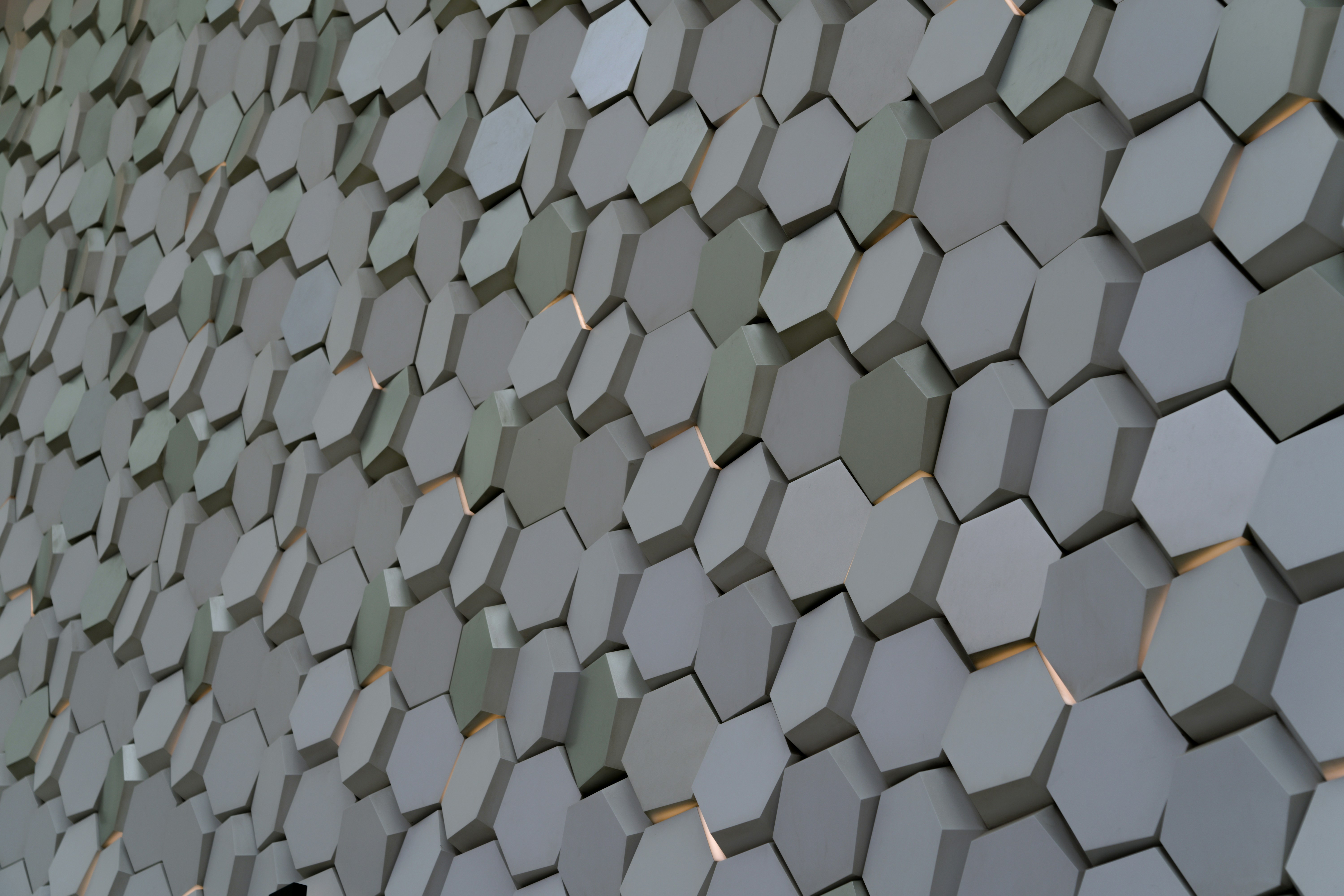 A close up of a wall made of hexagonal tiles photo – Free Lujiazui ...