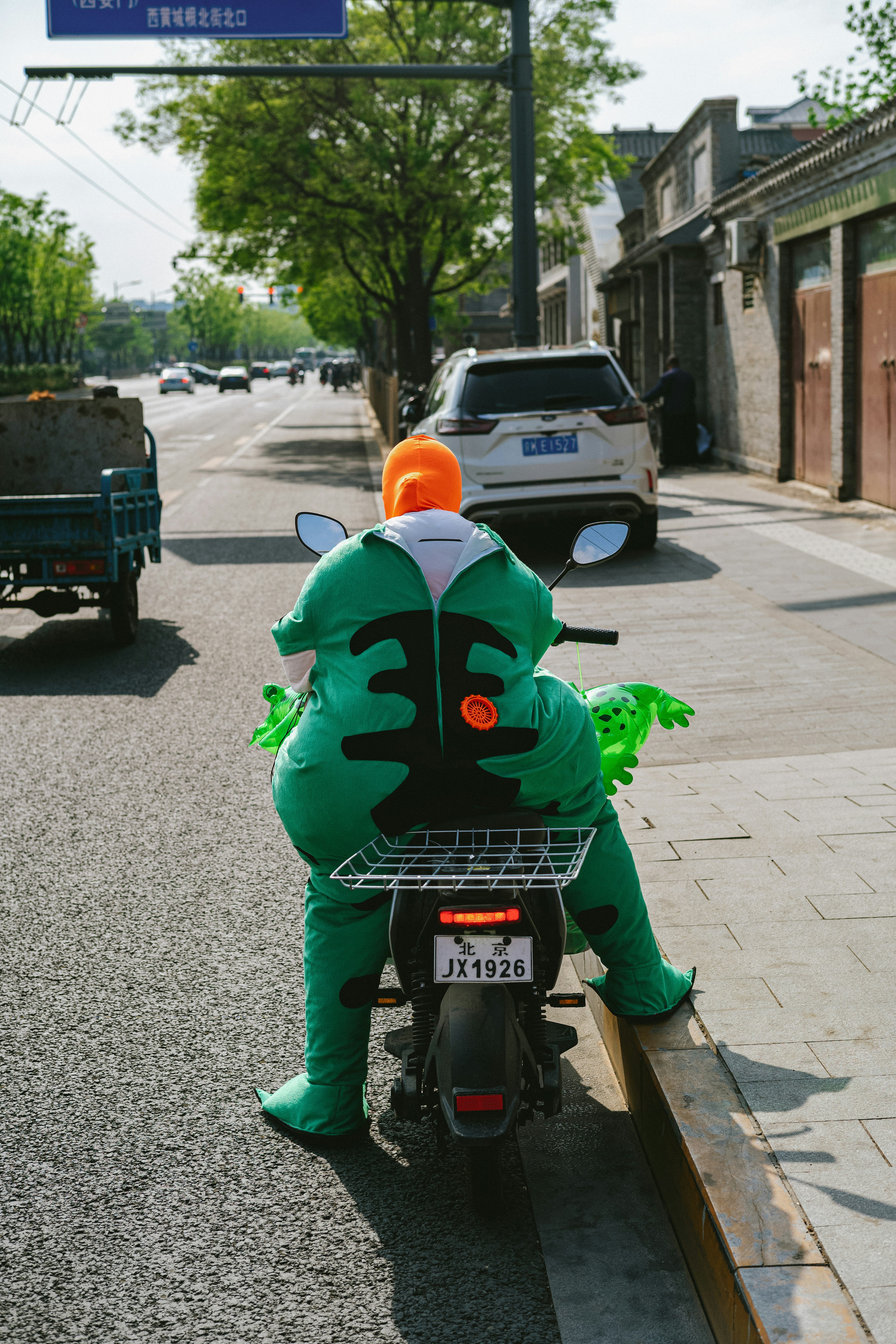 Neon Green Dino Rider Cruising a Quiet City Street