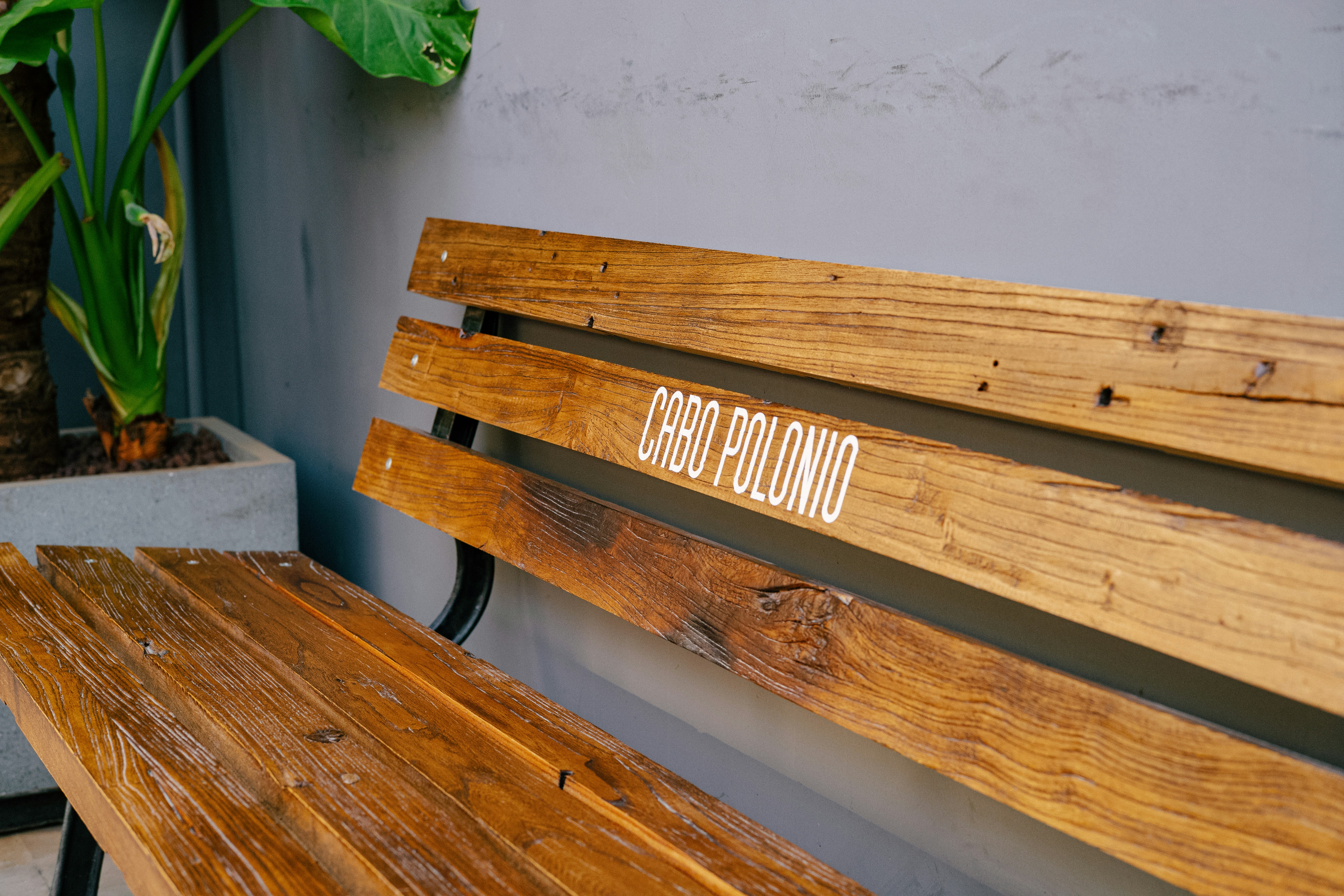 Weathered Slats and a Coastal Sign: Cabo Polonio Bench