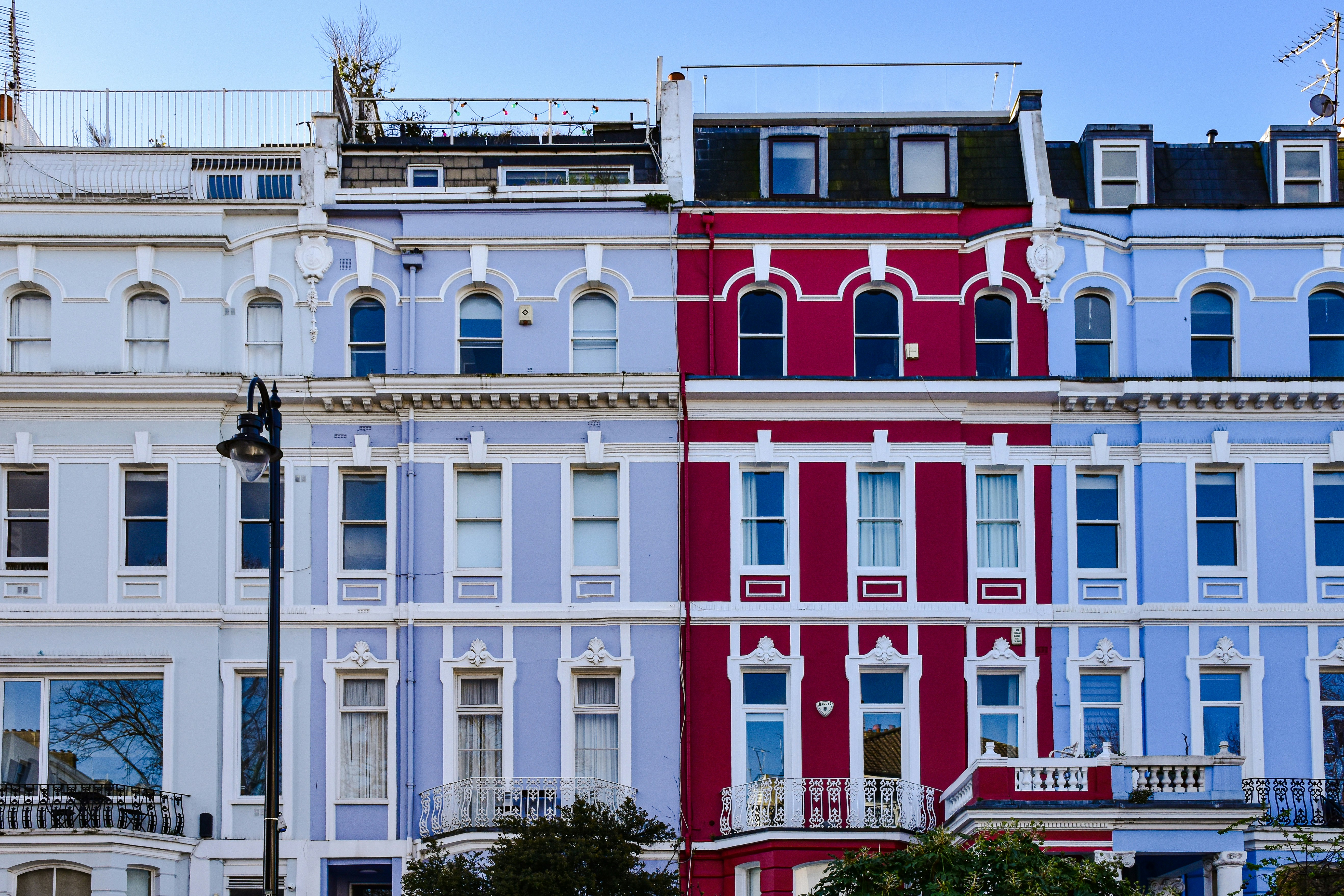 A row of multi - colored buildings on a city street photo – Free London ...