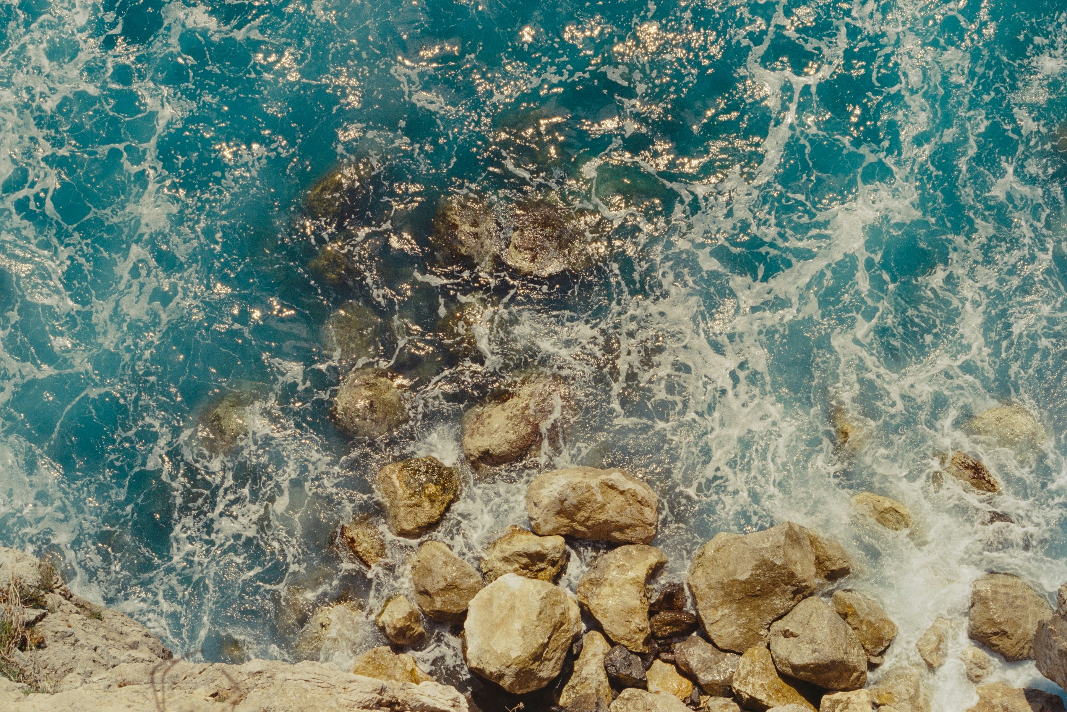A view of rocks and water from above photo – Free Mittelmeer Image on ...