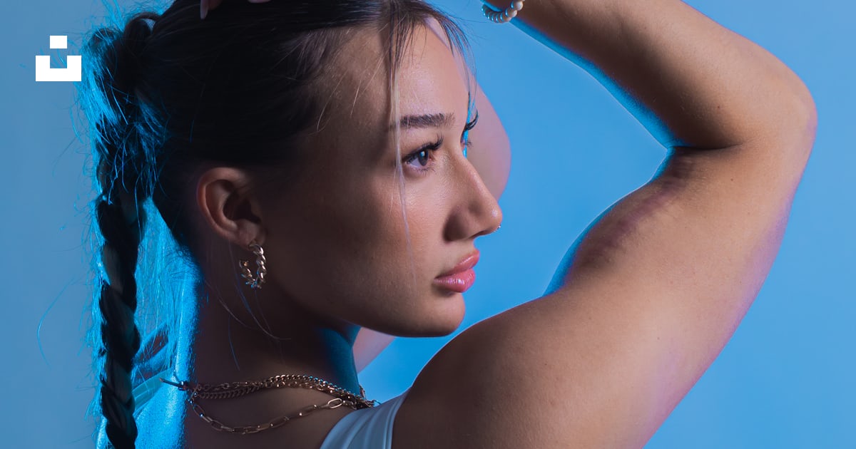 A Woman In A White Top Is Holding Her Hair Photo Free Sudbury Image