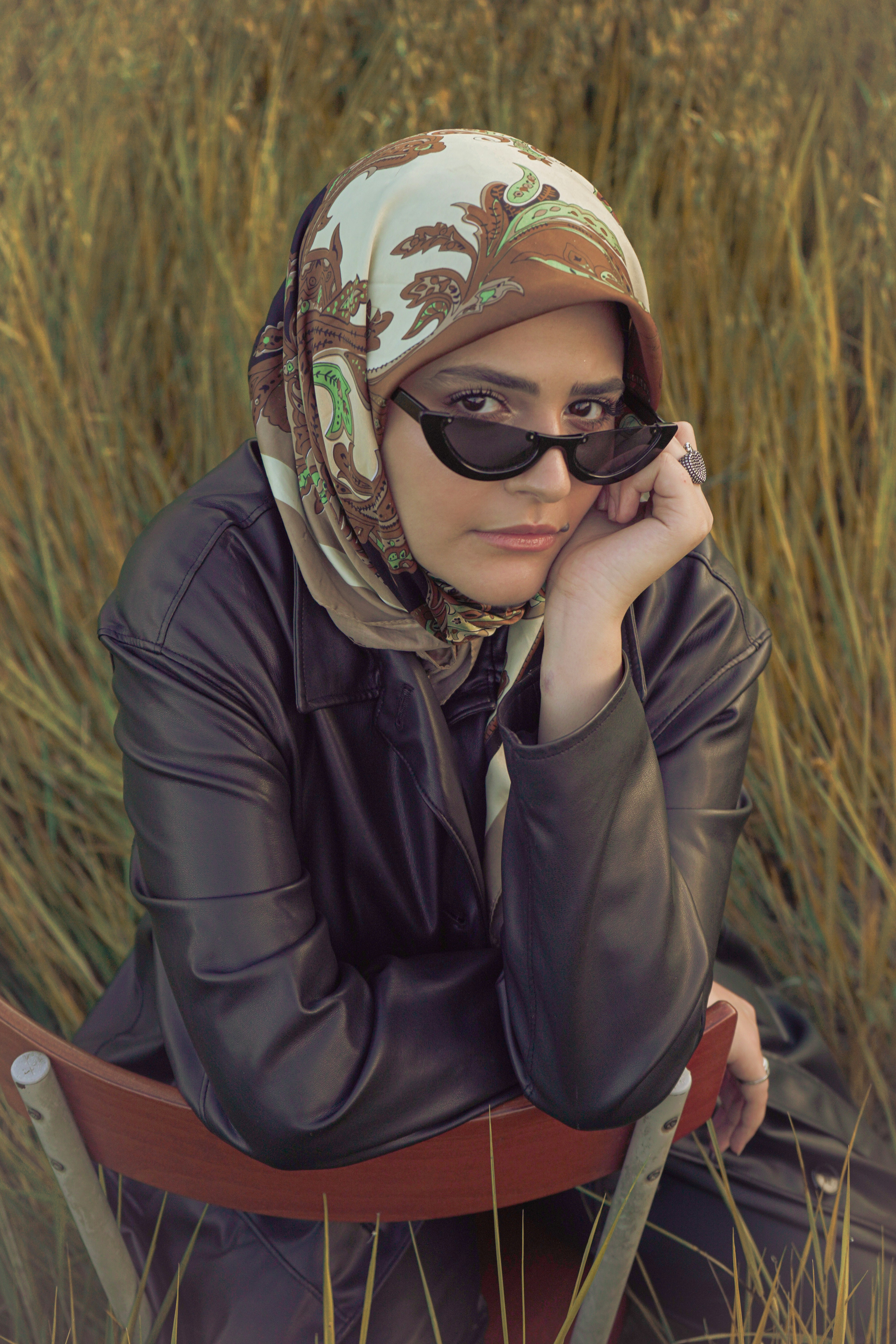 Gaze Through the Weeds: A Leather-Jacket Portrait in Autumn Light