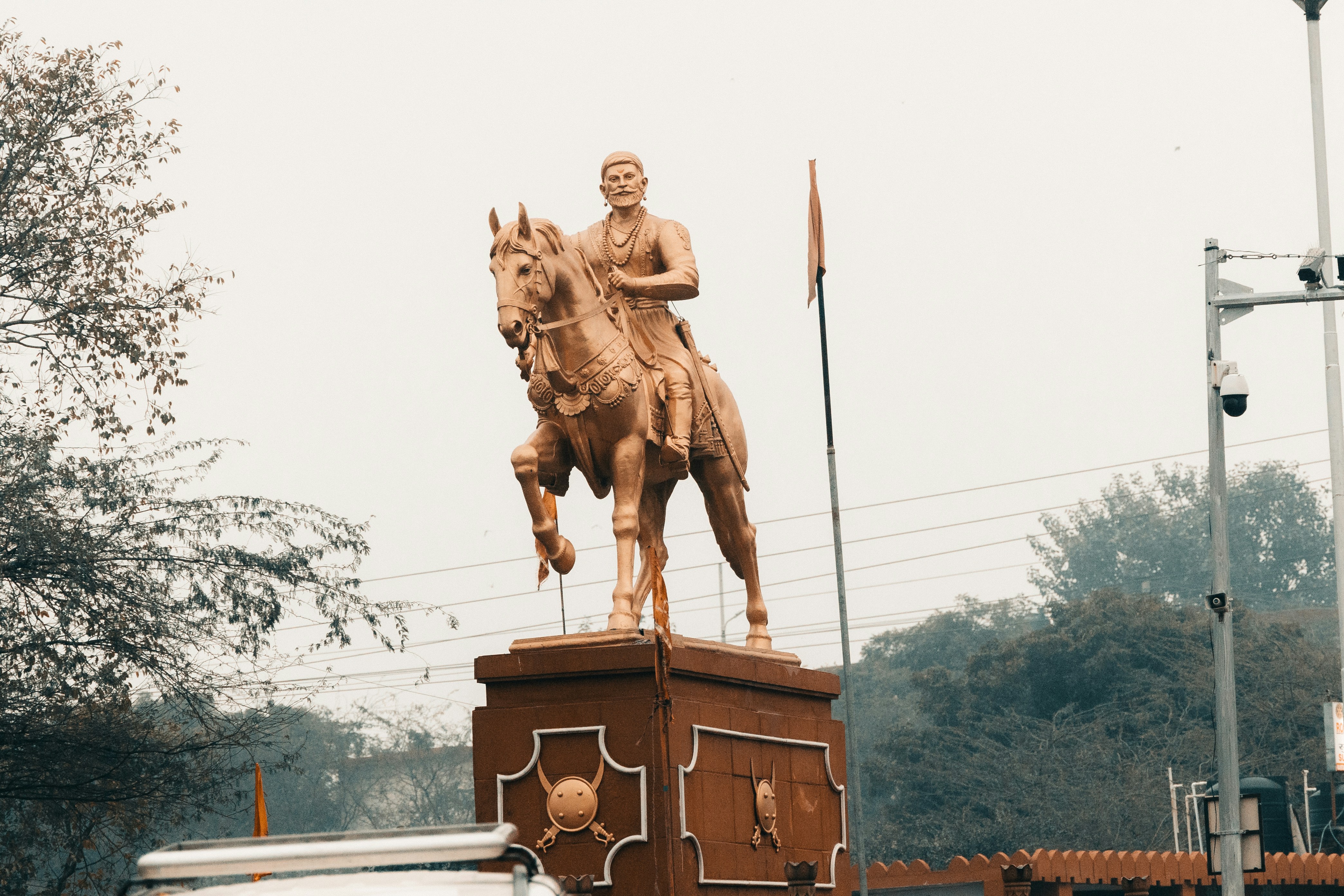 Bronze Rider on a Pedestal Amid a City’s Quiet Street