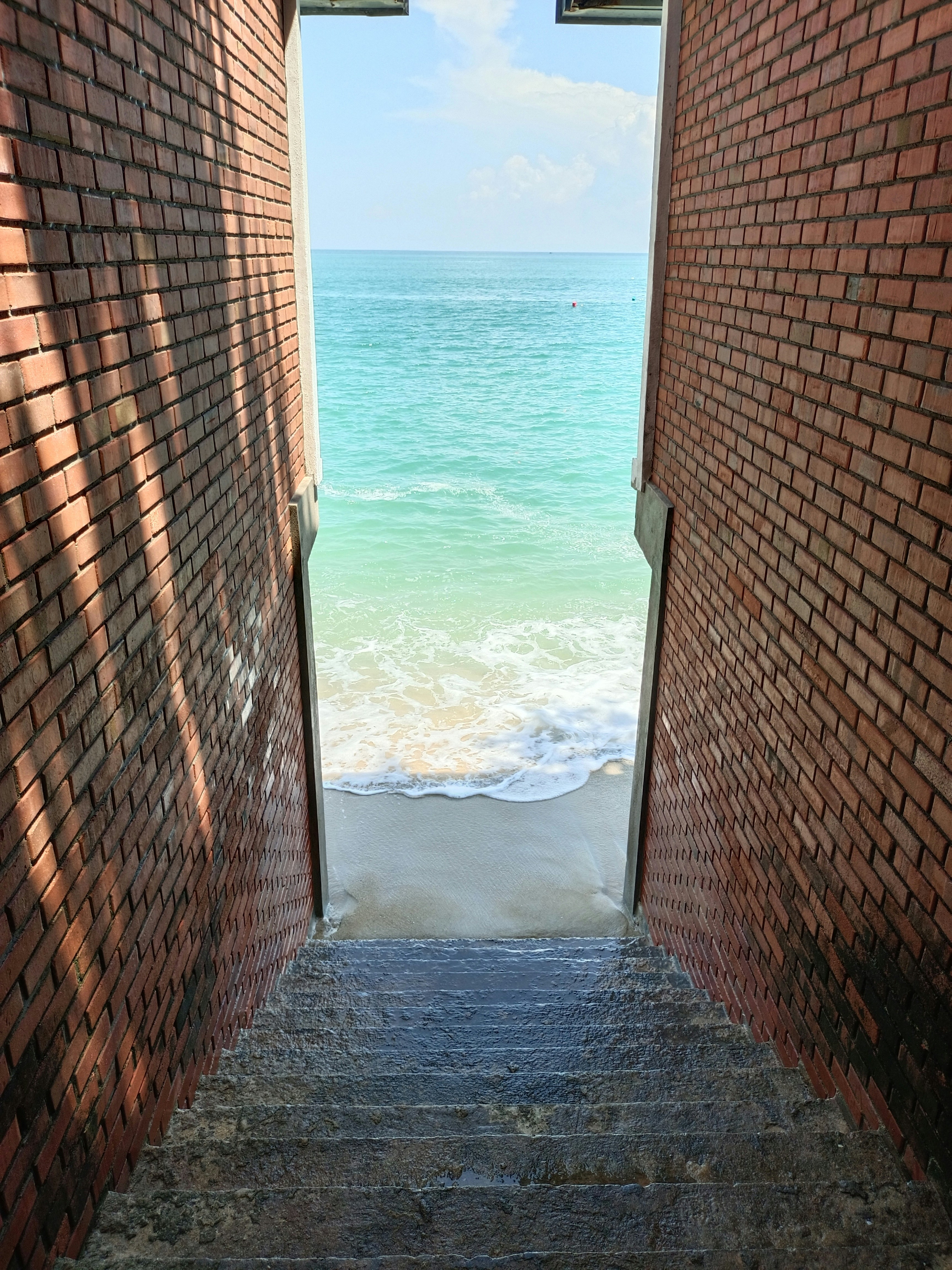 An open door leading to a beach with a view of the ocean photo – Free ...