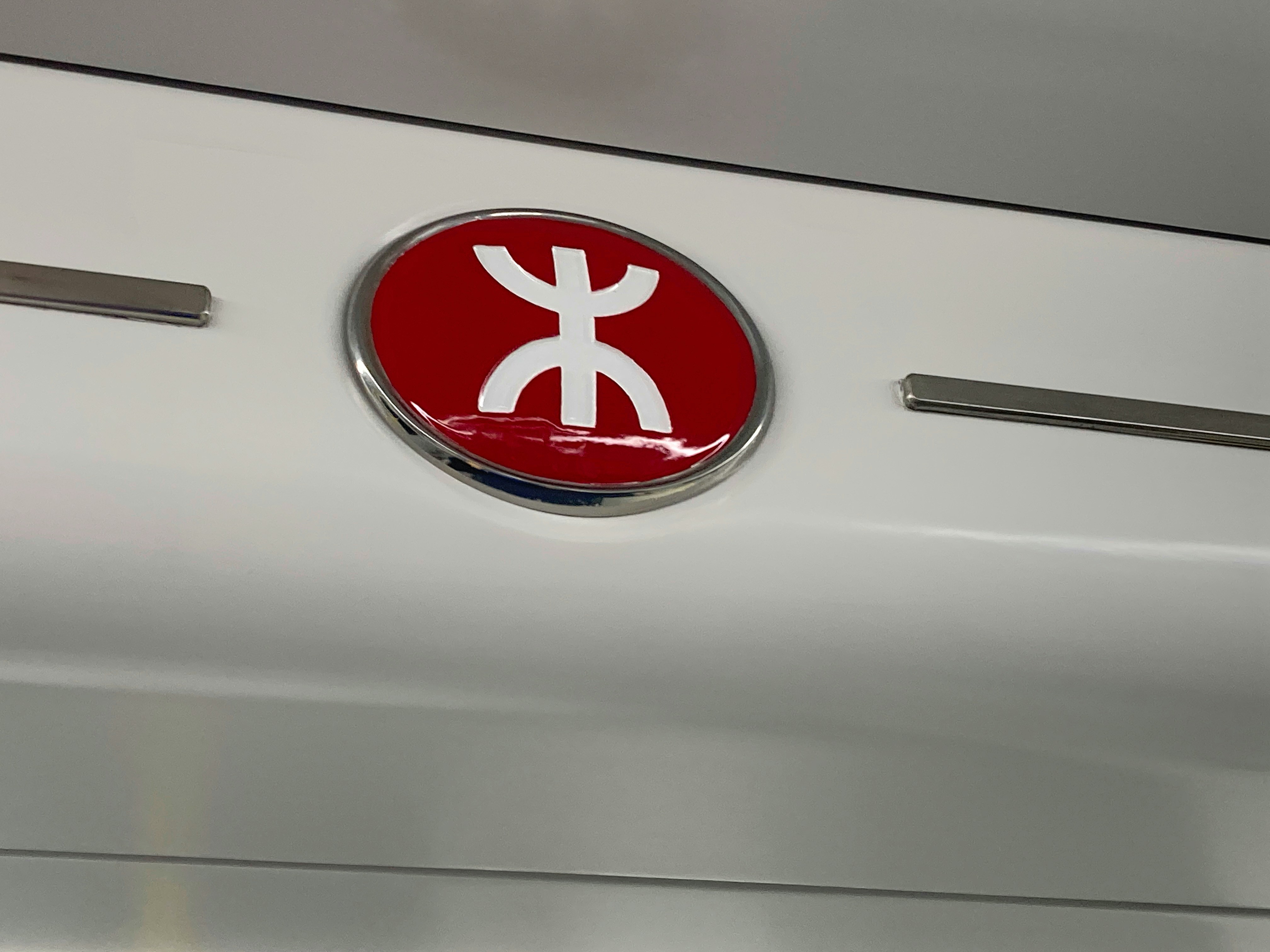 Crimson Emblem Framed by a Pristine White Panel