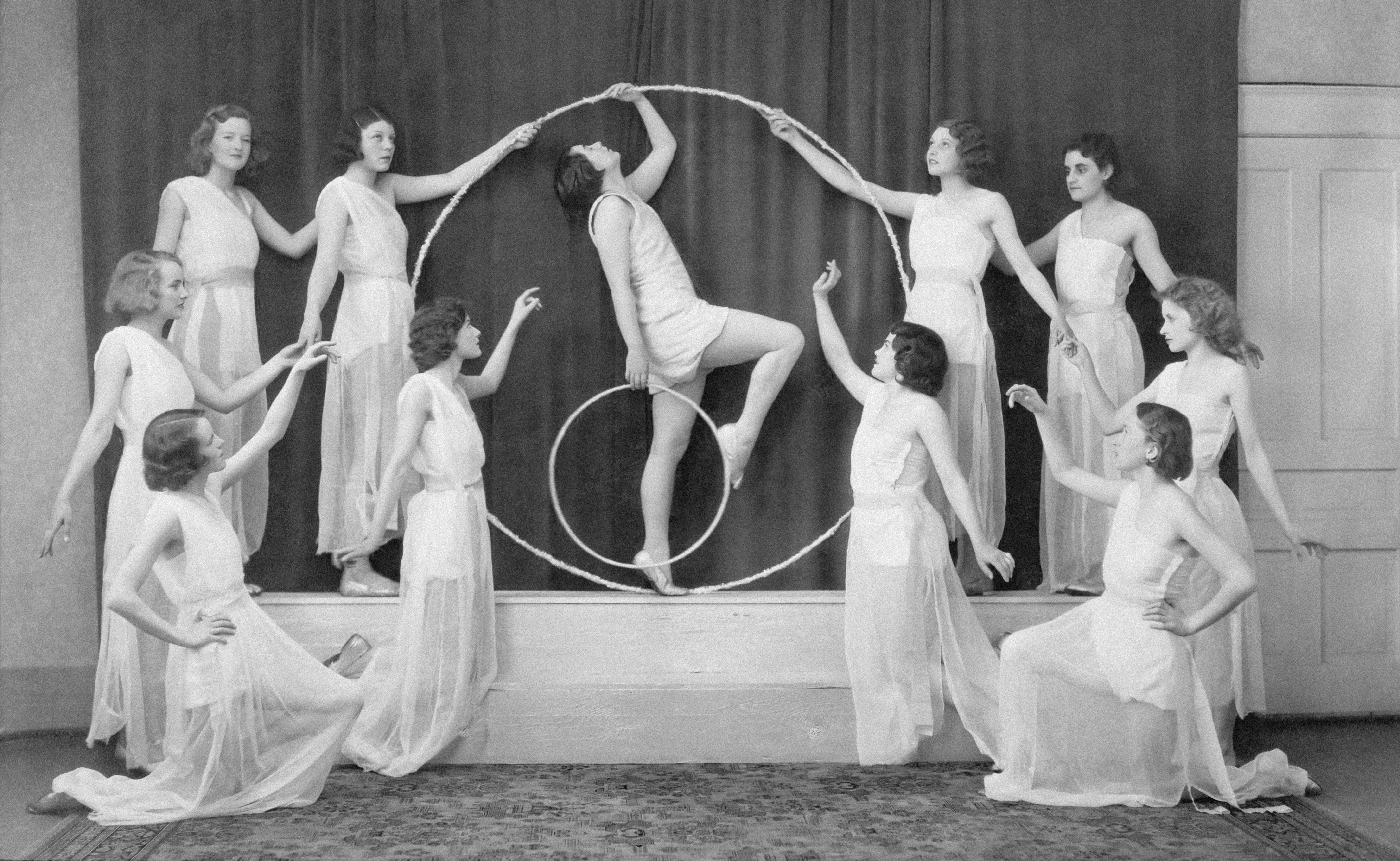 A group of women standing around a hula hoop photo – Free Historical ...