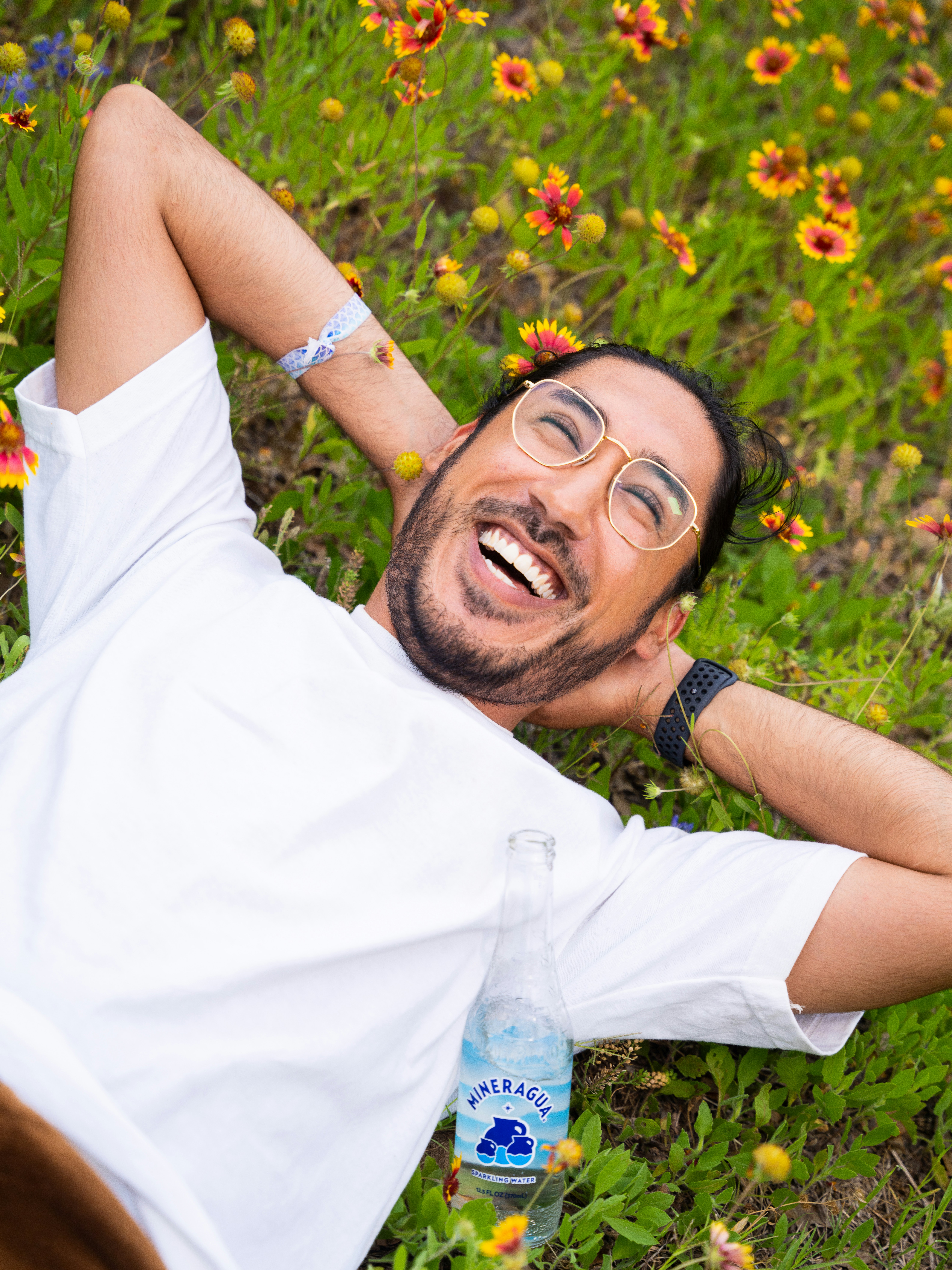 Meadow Laughter: A relaxed portrait among sunlit wildflowers