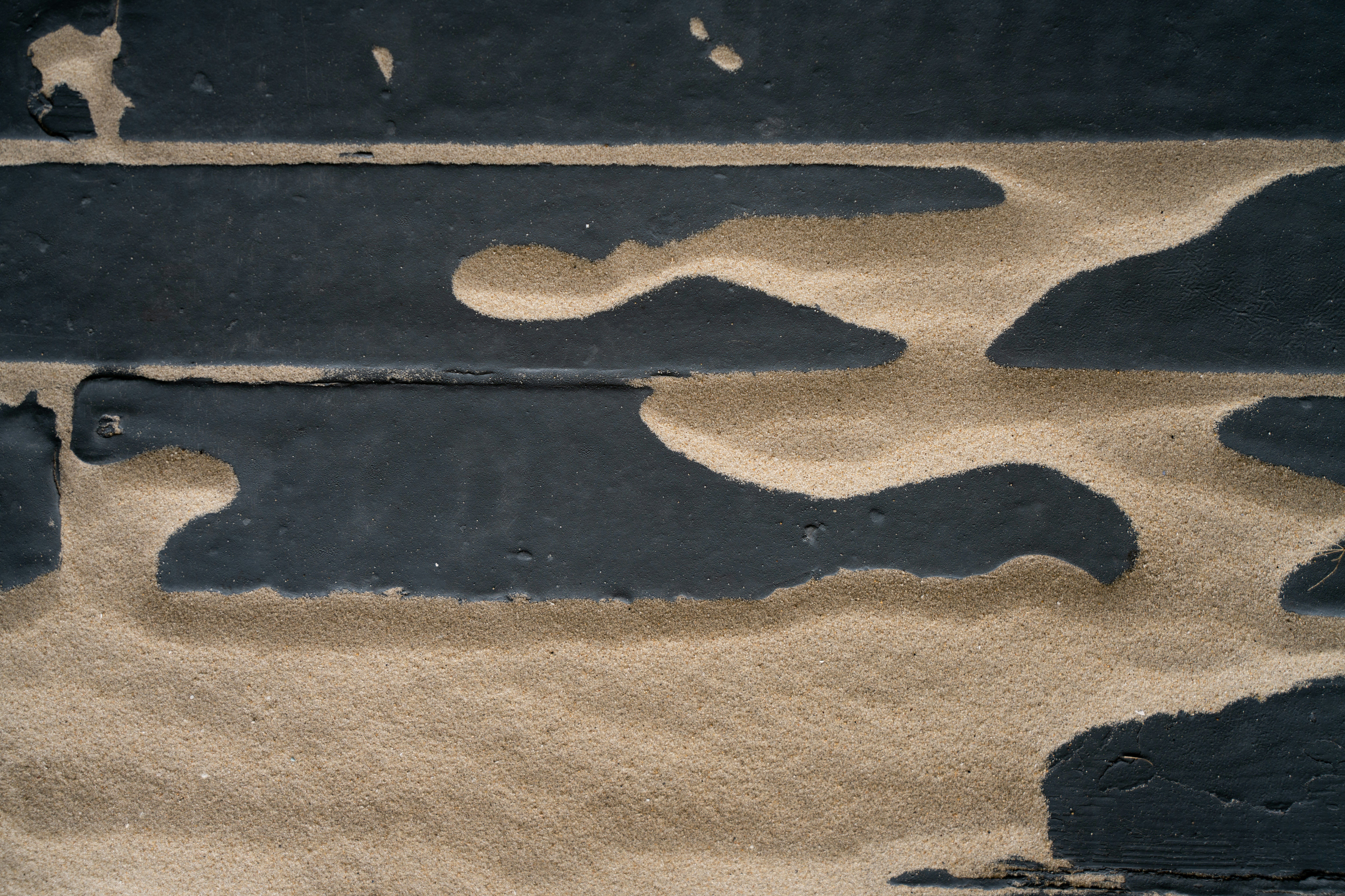 Whispers of Time: The Dance of Sand and Surface
