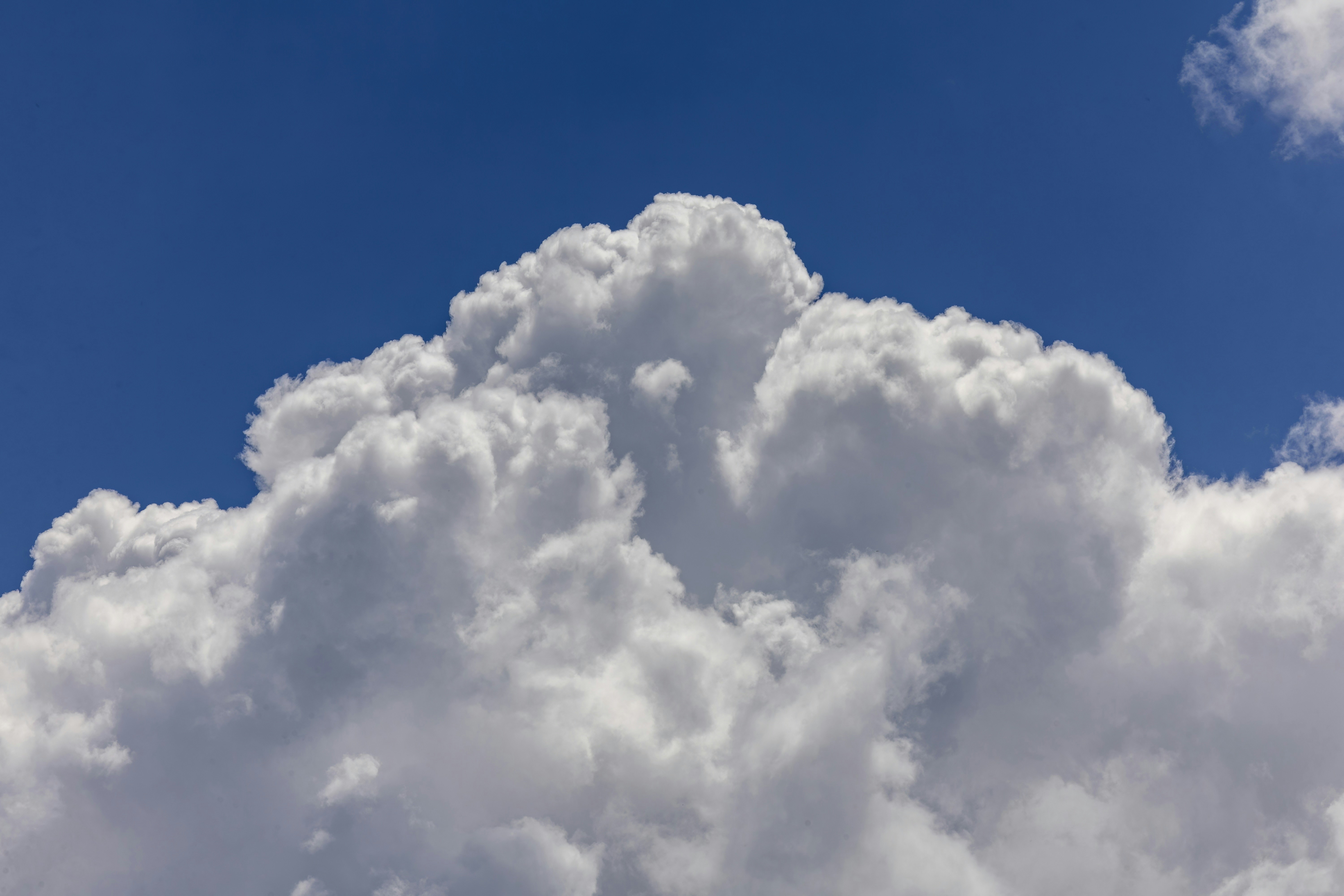 A plane flying through a cloud filled sky photo – Free Cloud Image on ...