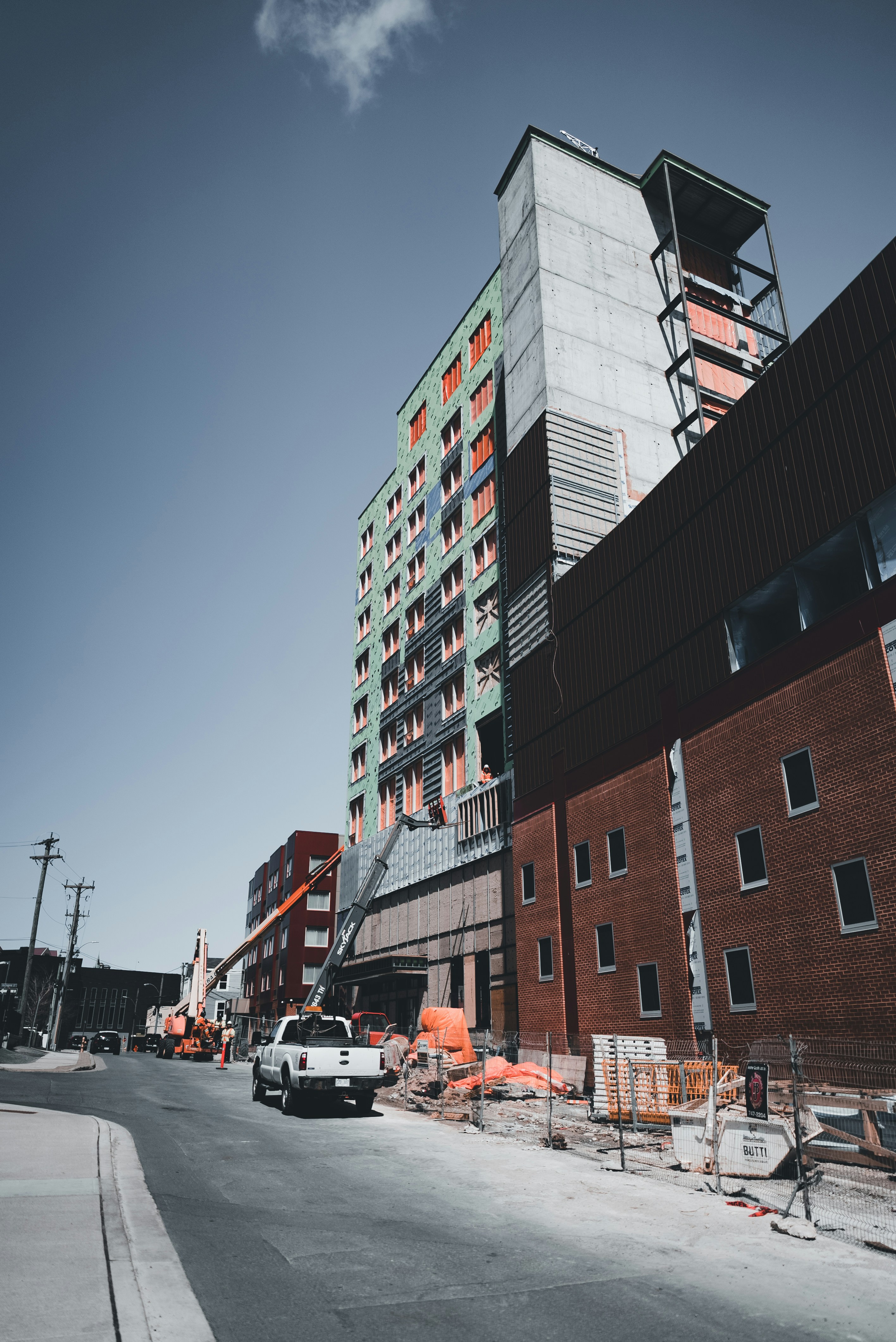 A construction site with a large building in the background photo ...