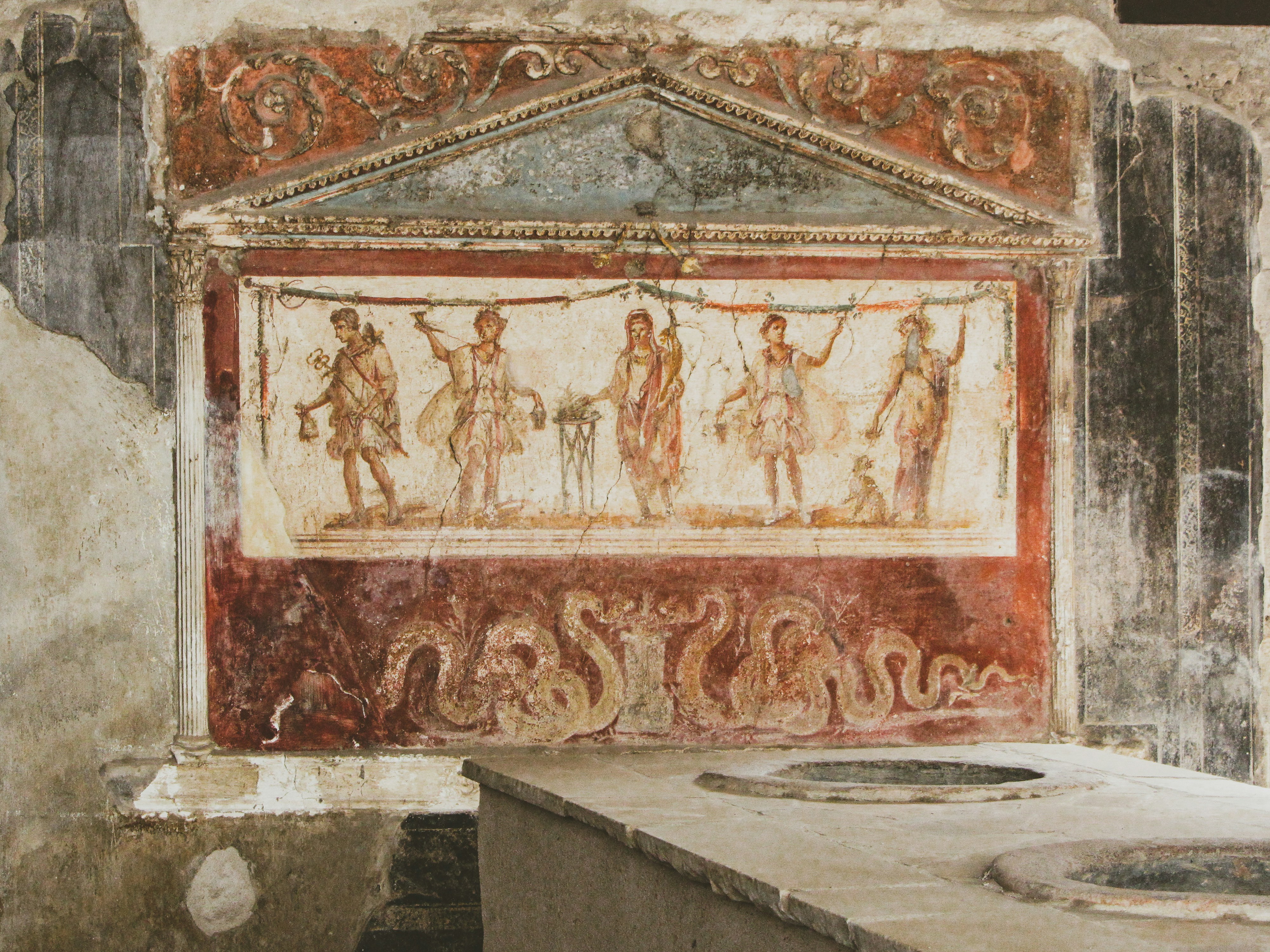 Ancient Roman fresco | a painting on the side of a building