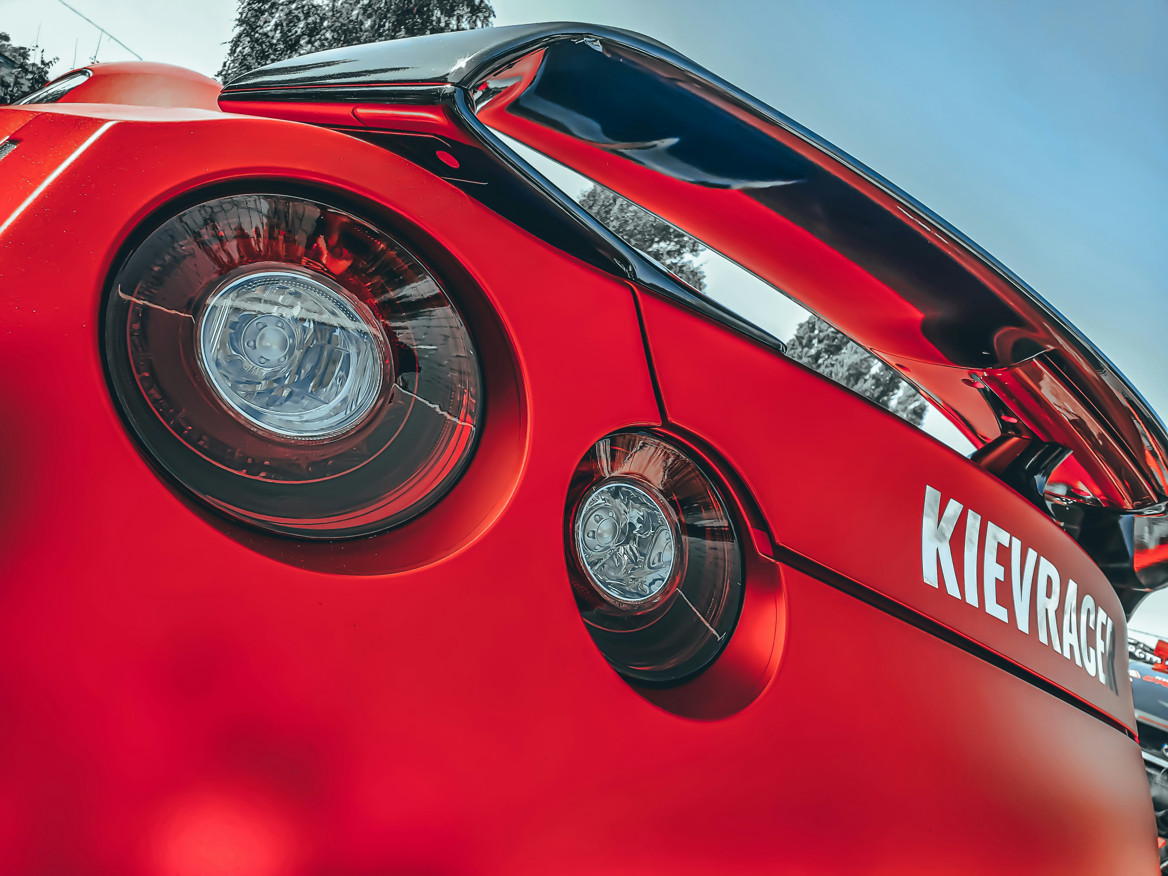 Crimson Gullwing Frontal: A Front-Quarter Portrait of Speed