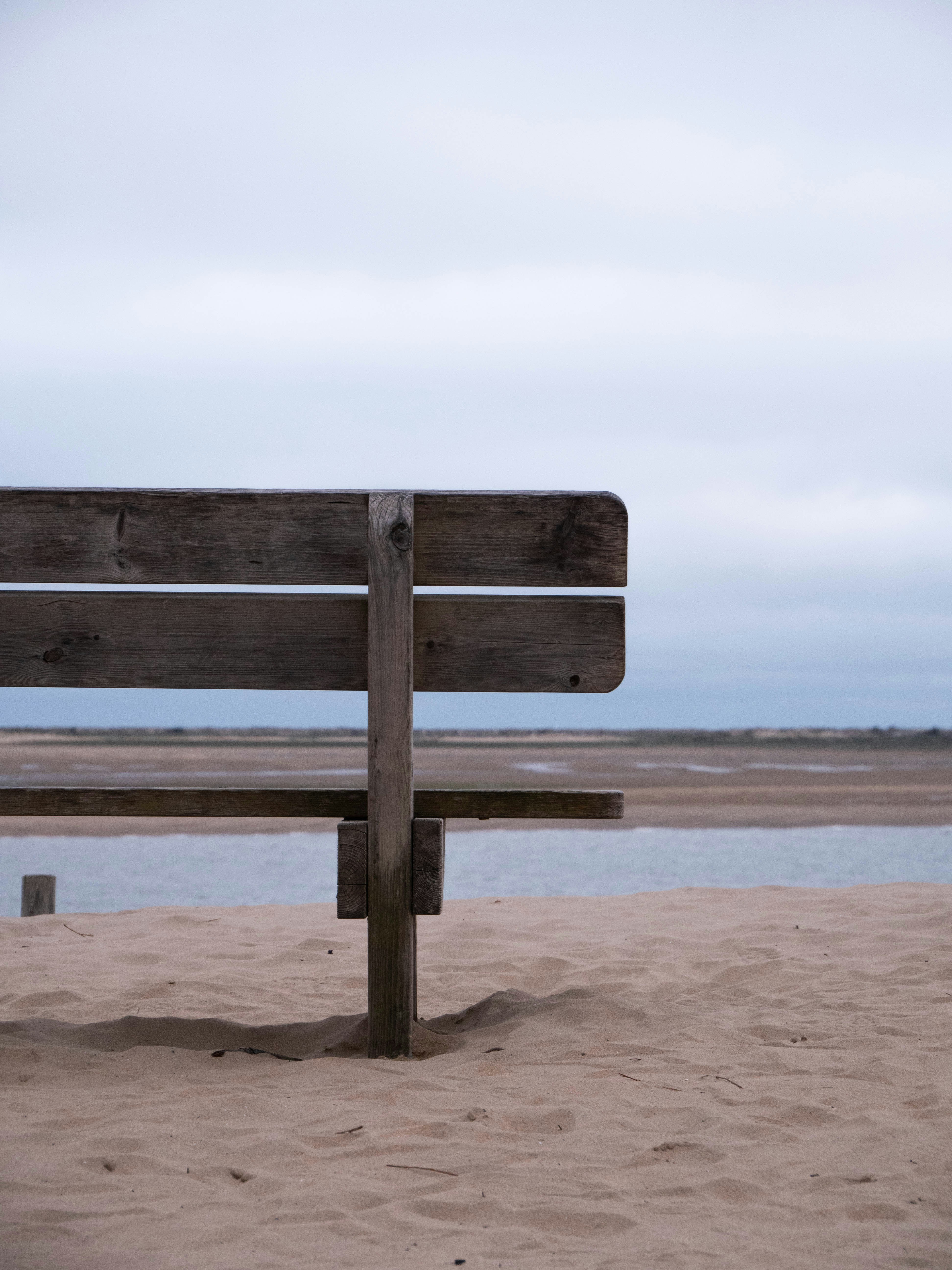Weathered Bench Framing a Quiet Coastal Horizon