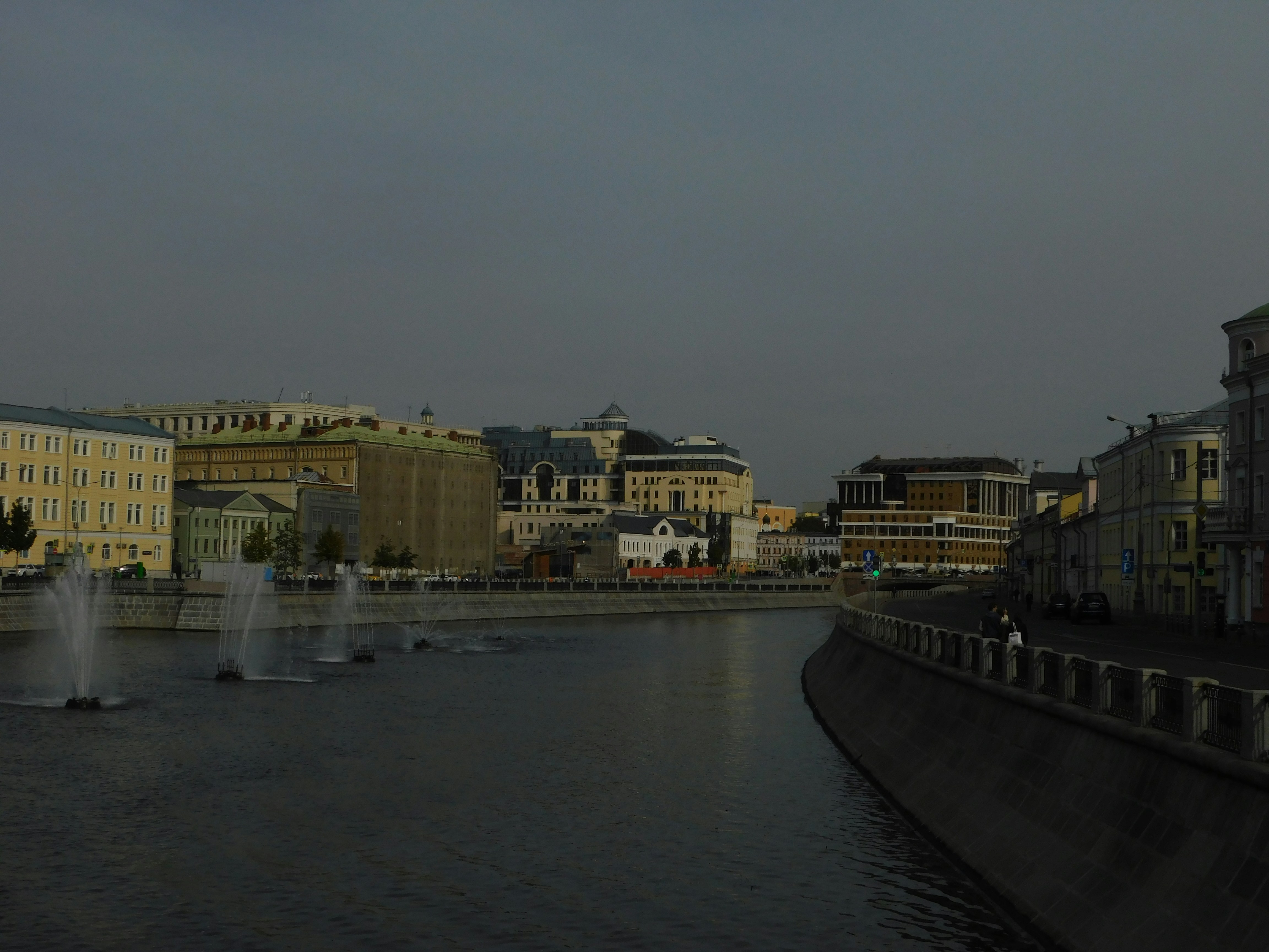 Evening Fountains Along a Historic Riverfront