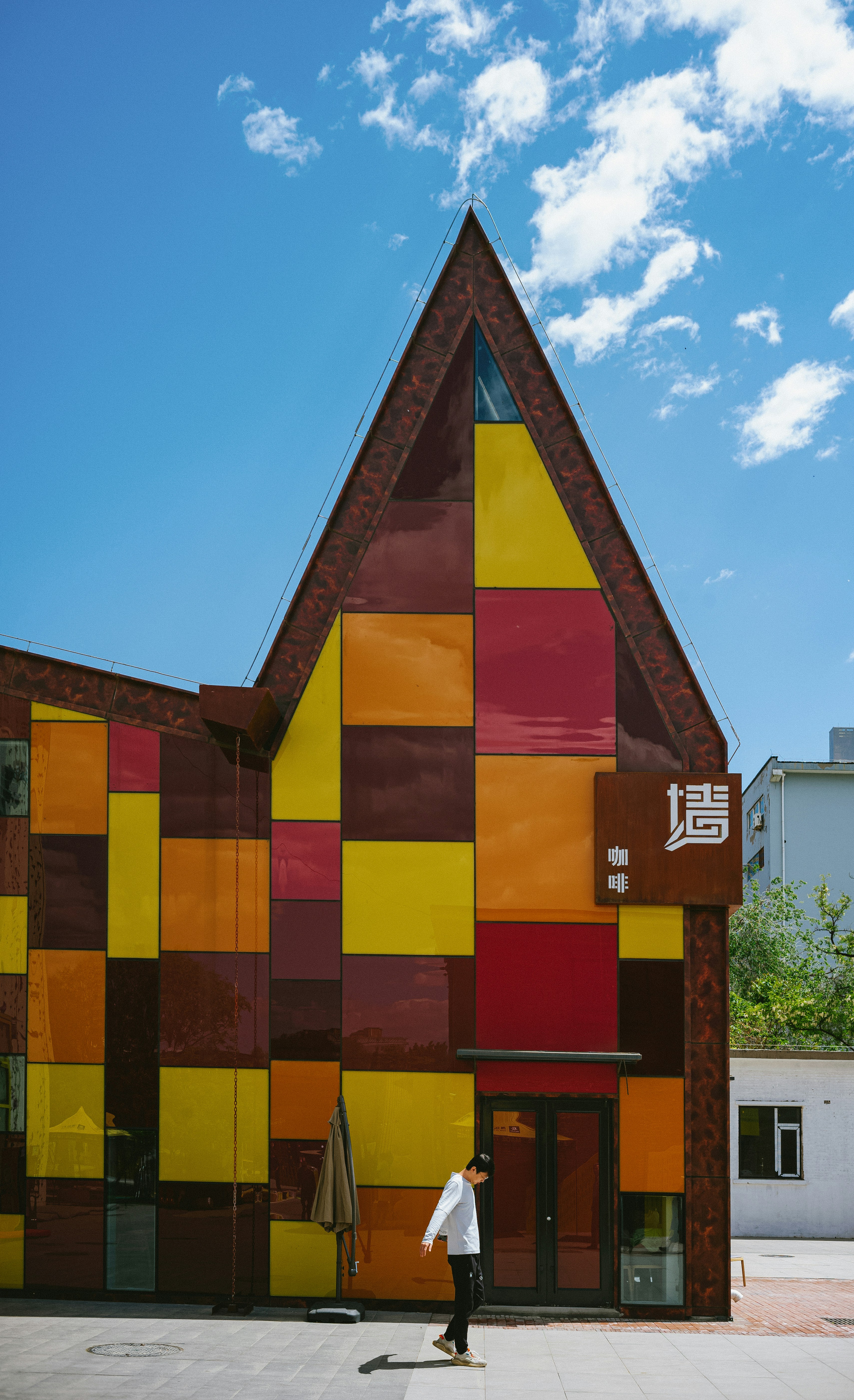 Apex of Color Blocks under a Clear Blue Sky