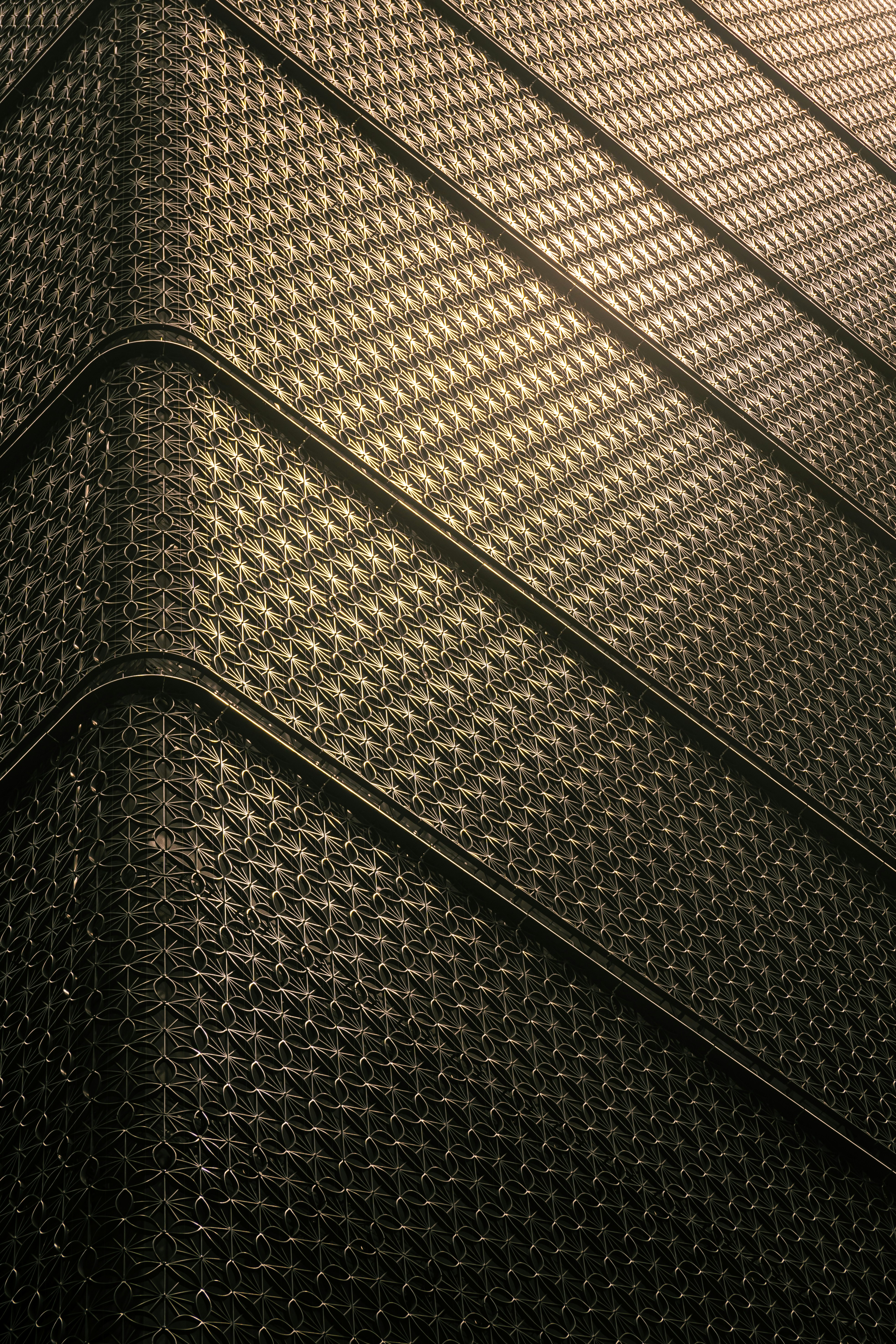 Geometric Rhythm: A Close-Up of Repeating Metal Lattice