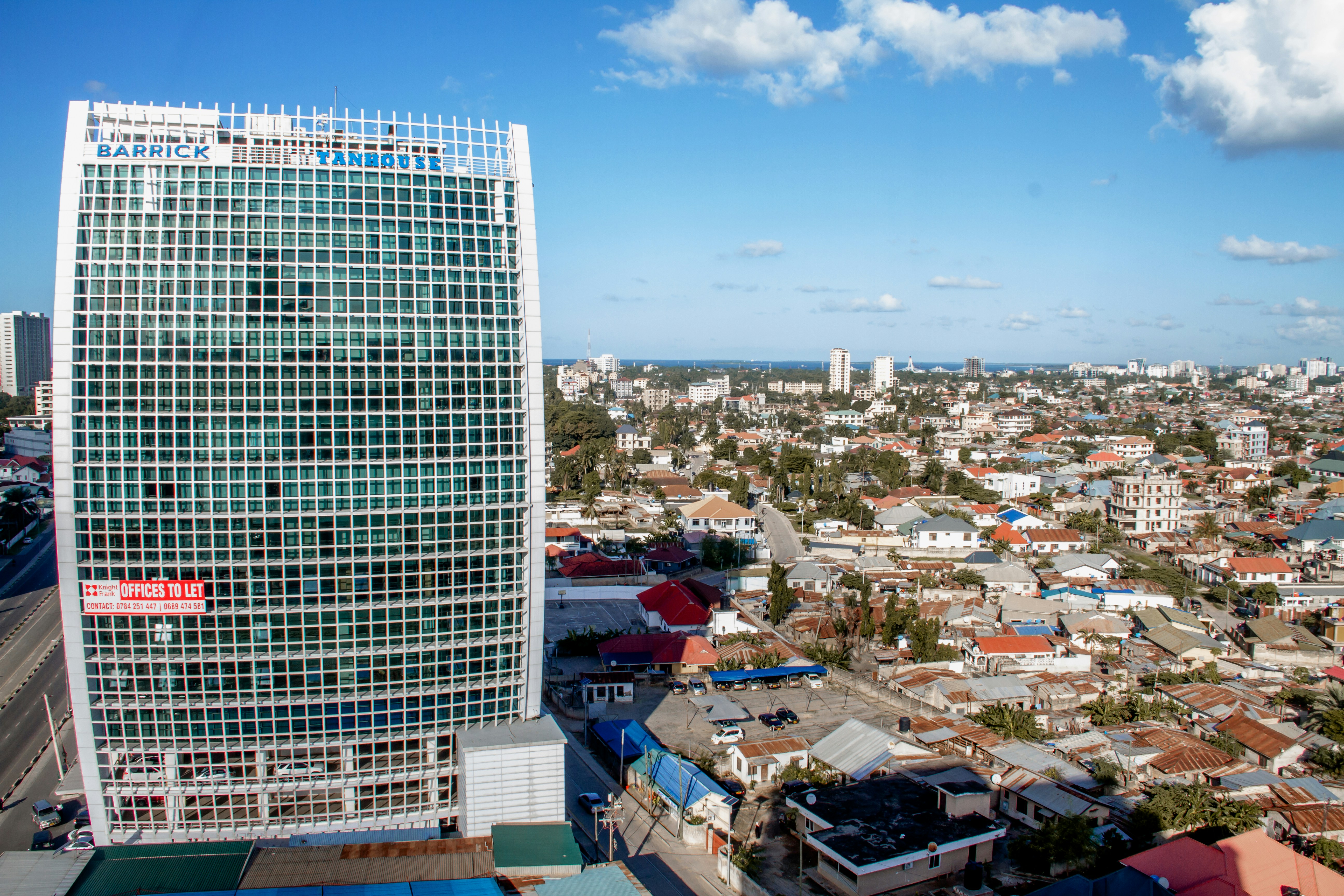 A view of a city from the top of a building photo – Free Barrick ...