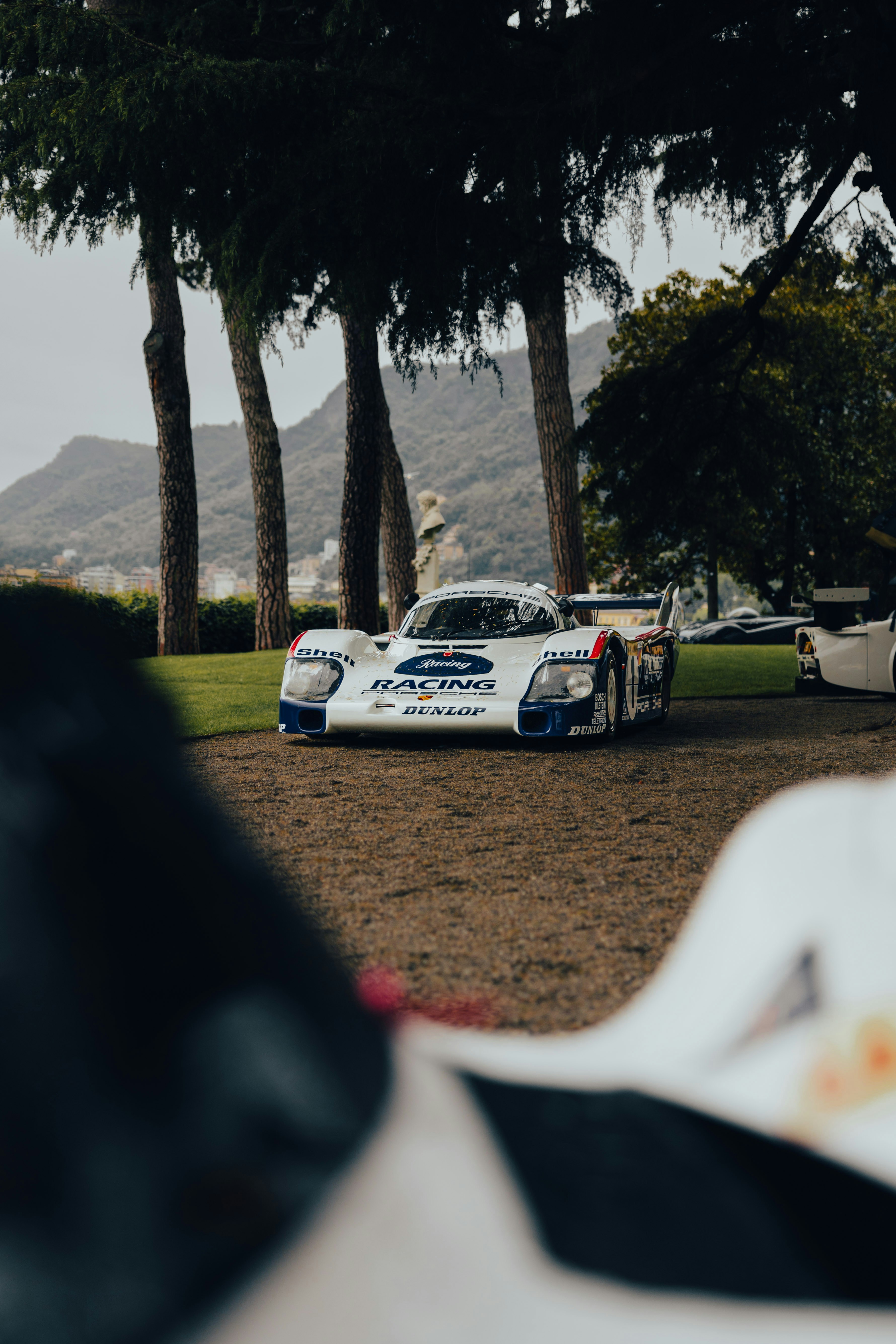 A race car parked in front of some trees photo – Free Car Image on Unsplash