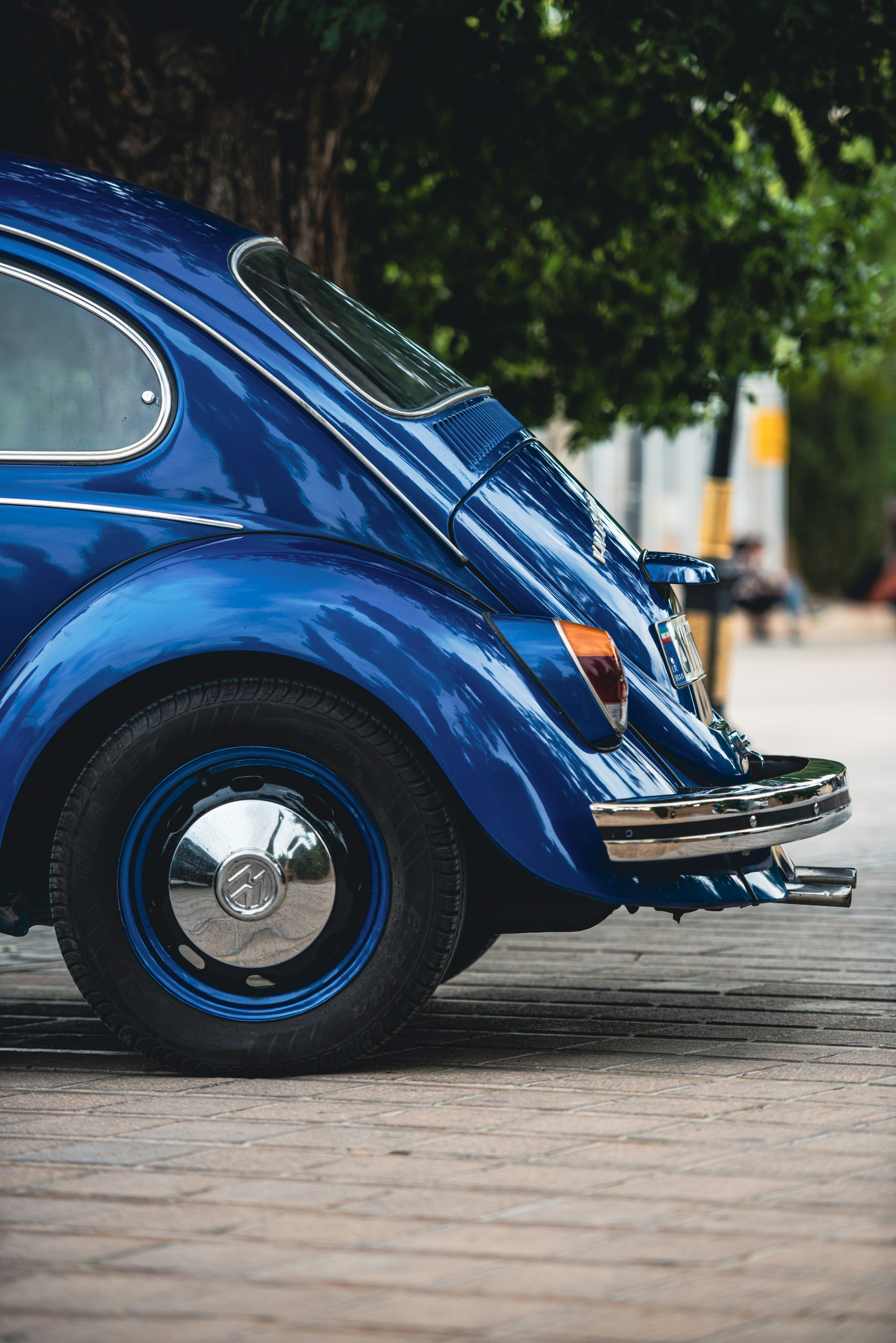 A blue vw bug parked on the side of the road photo – Free Shiraz Image ...