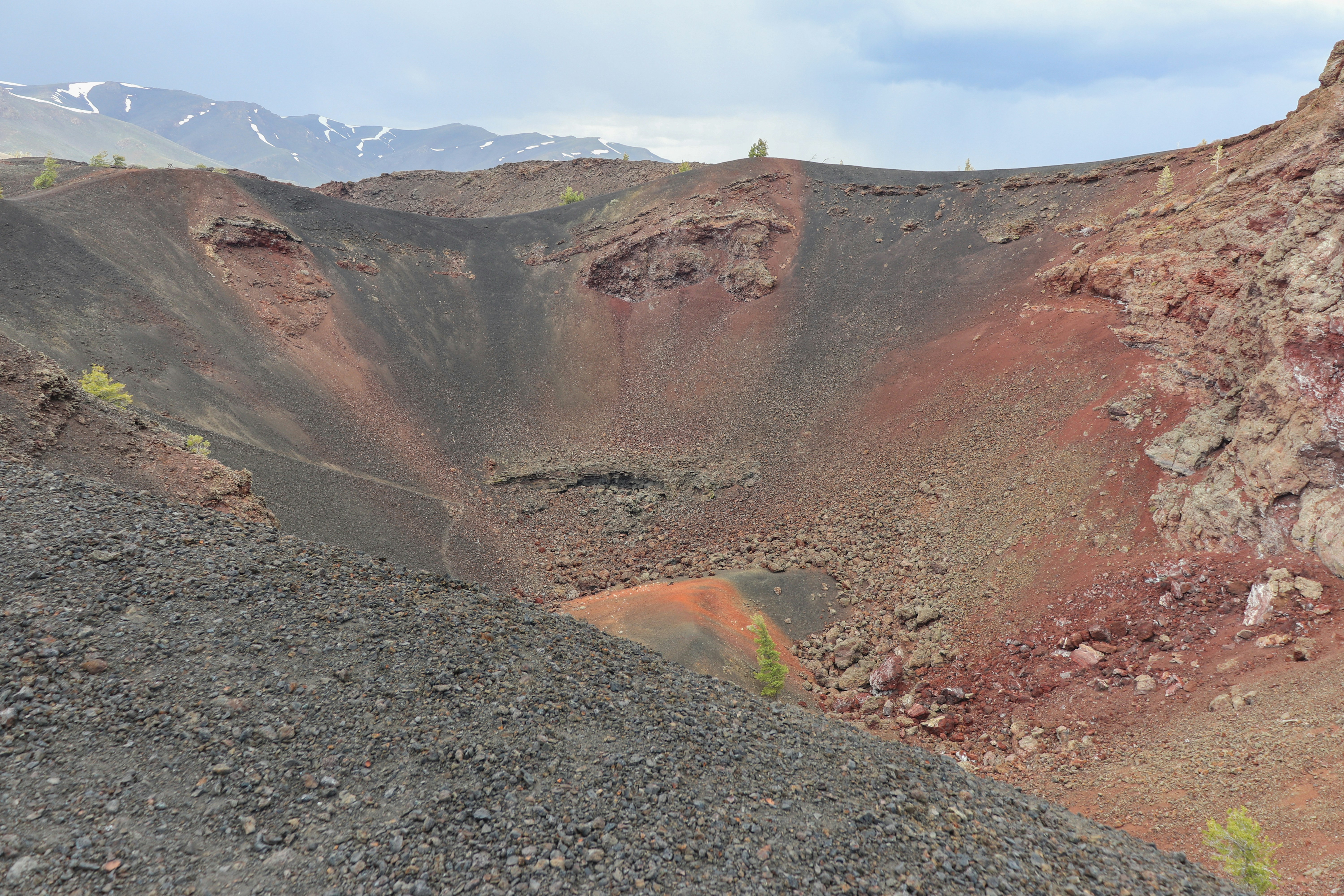 A view of a barren area with mountains in the background photo – Free ...