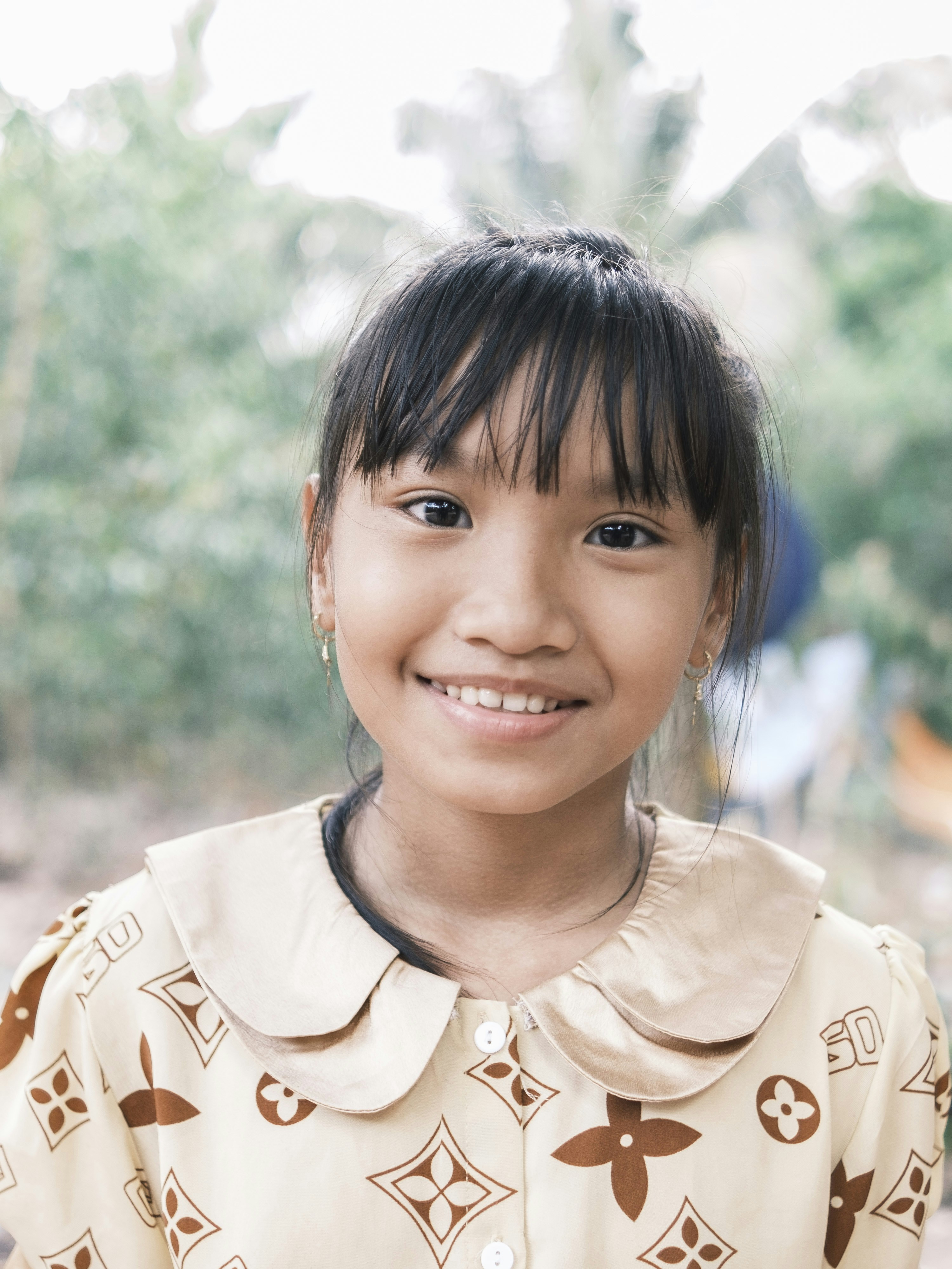 A young girl with a smile on her face photo – Free Portrait Image on ...
