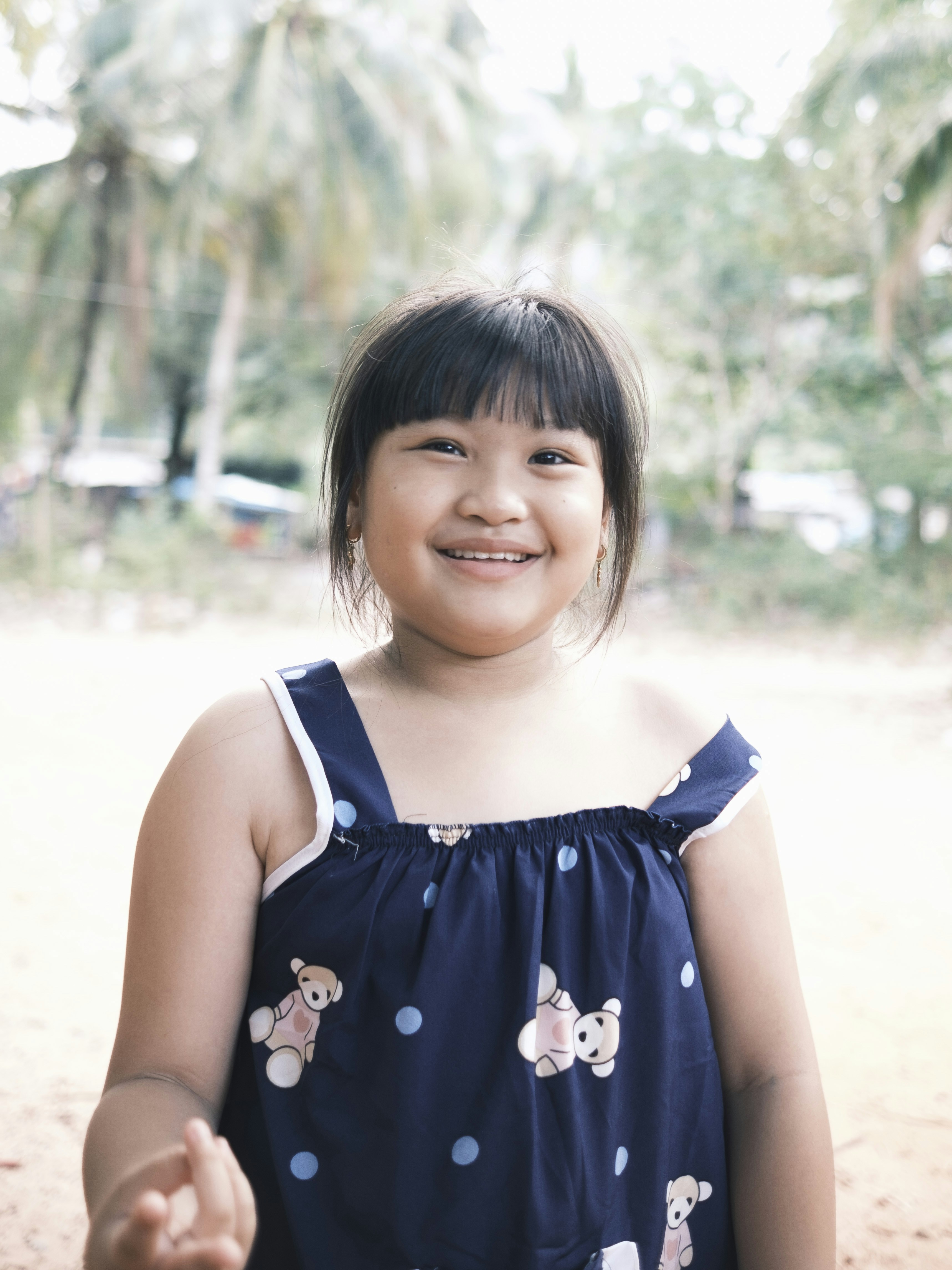 A little girl is smiling for the camera photo – Free Phu quoc Image on ...