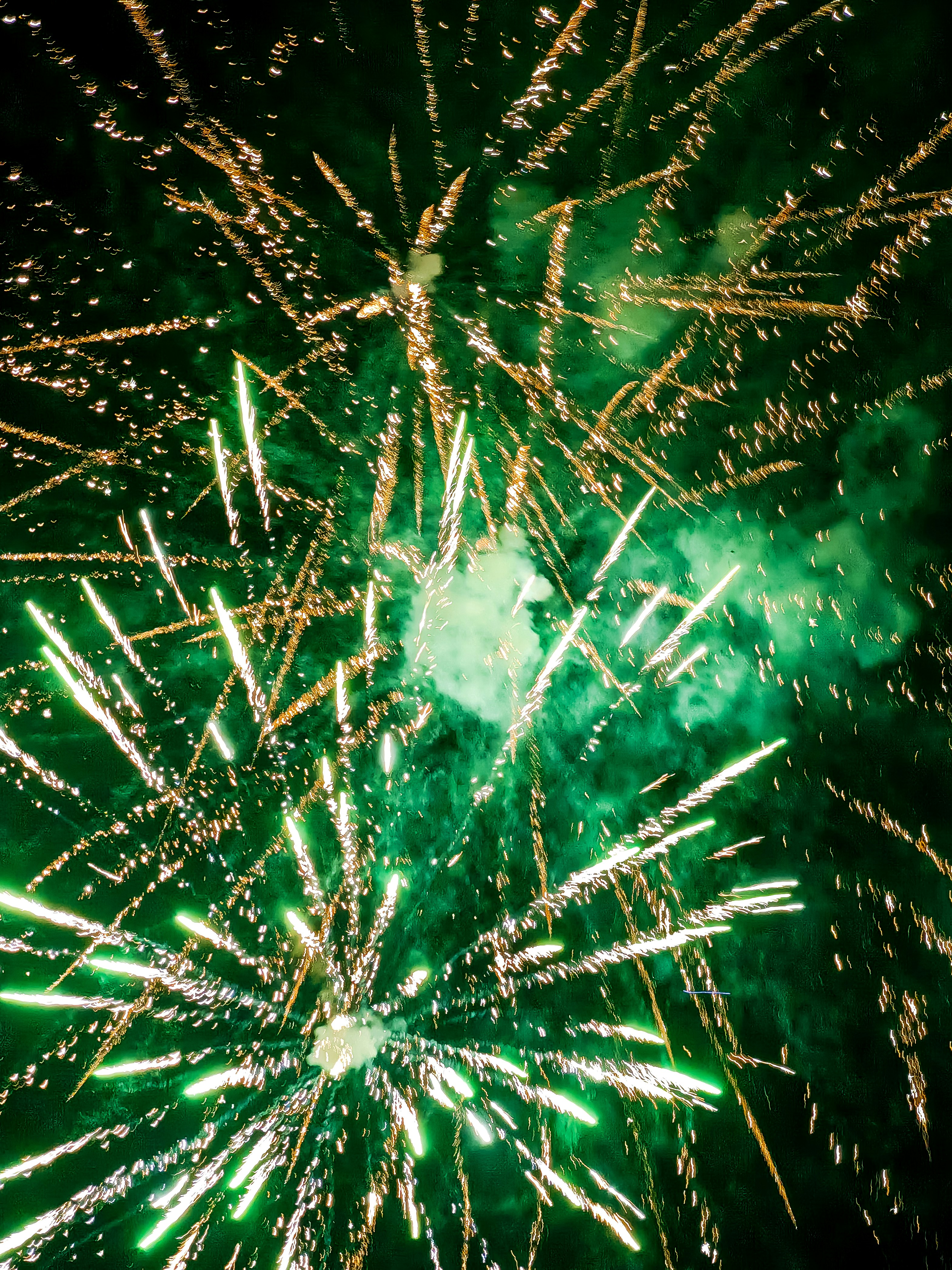 A green and white fireworks is in the sky photo – Free Fireworks Image ...