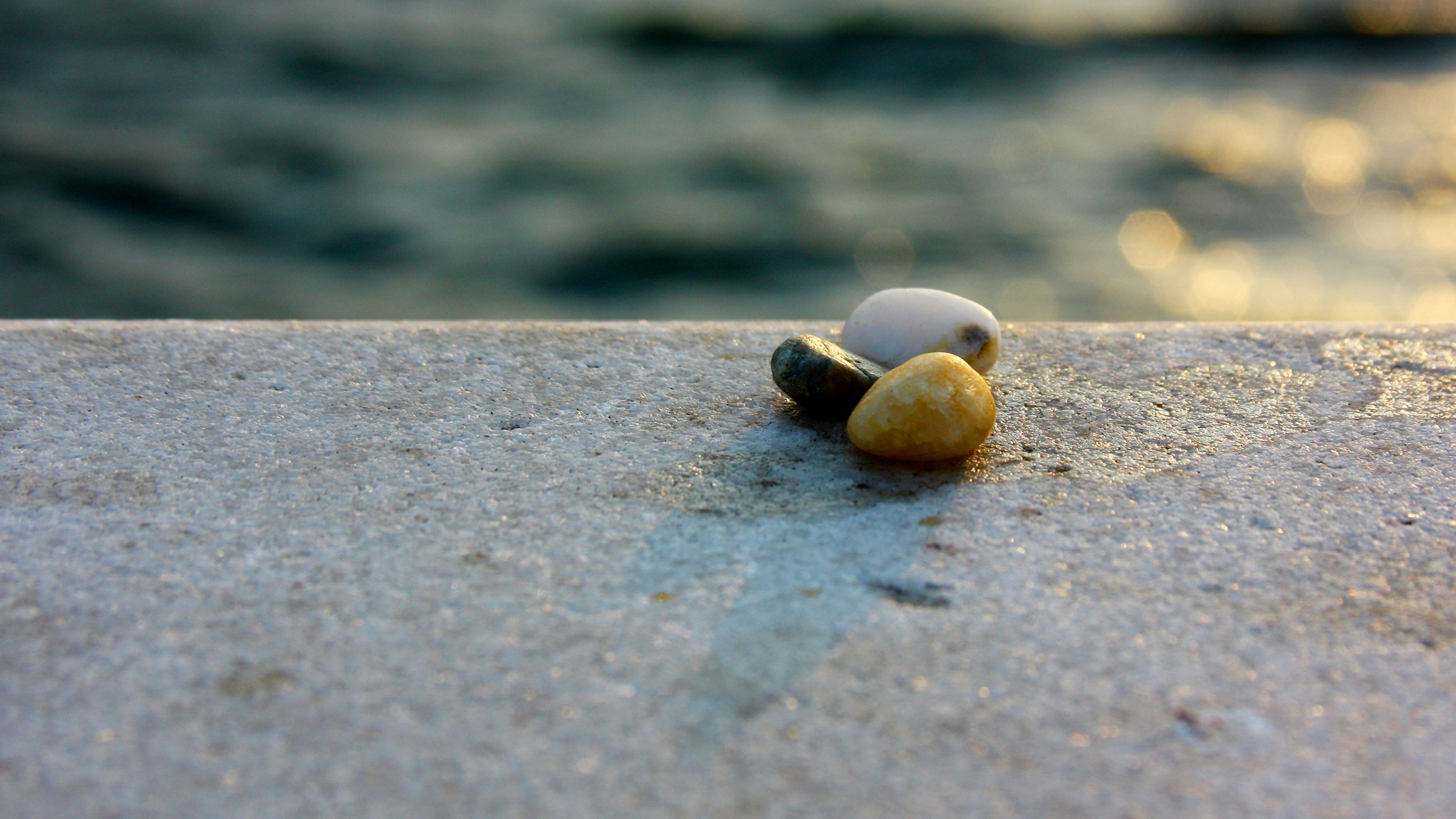 Pebbles at the Waterline: A Quiet Study in Texture and Light