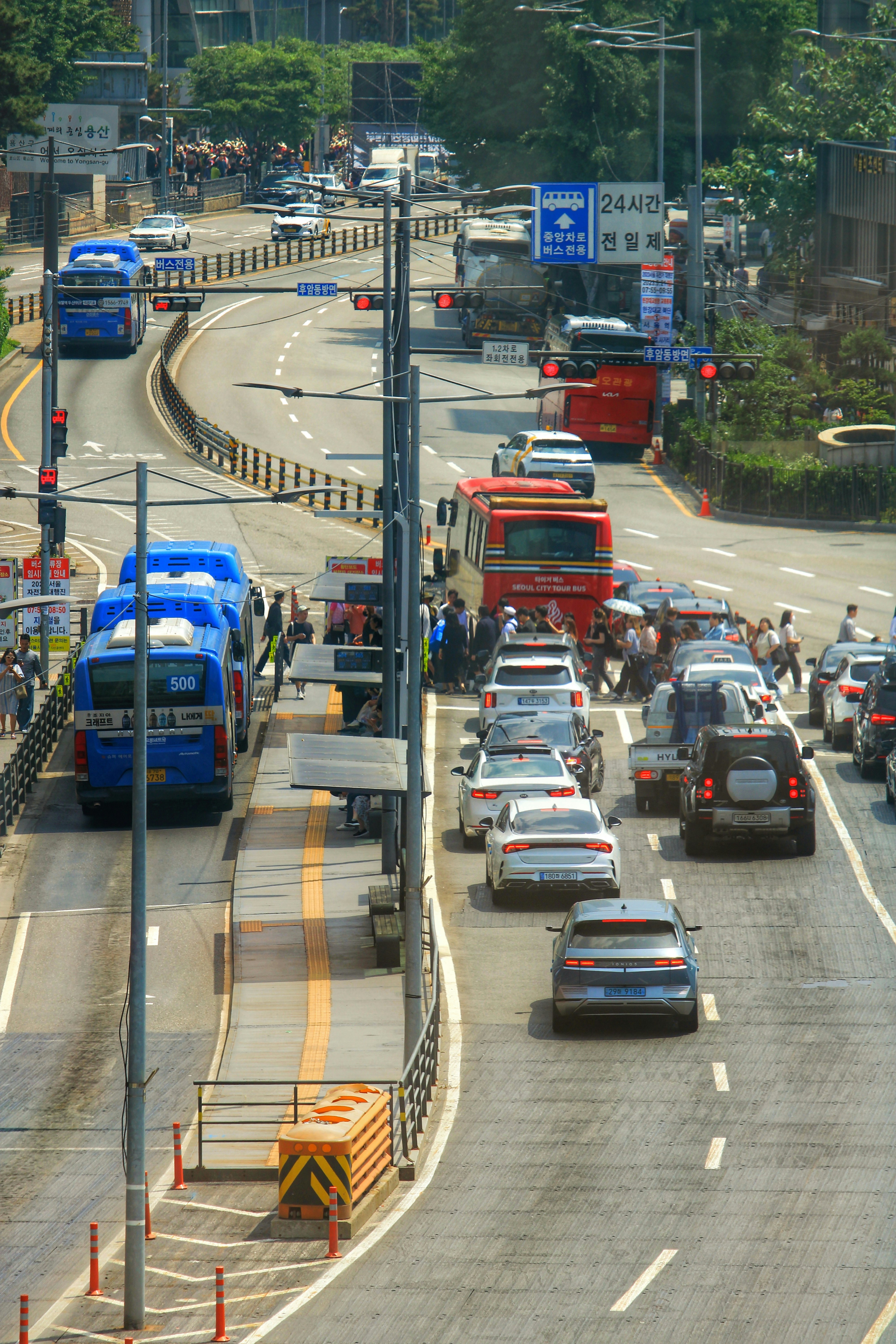 Rush Hour Tangle on a Korean City Street: Buses, Cars, and Signals