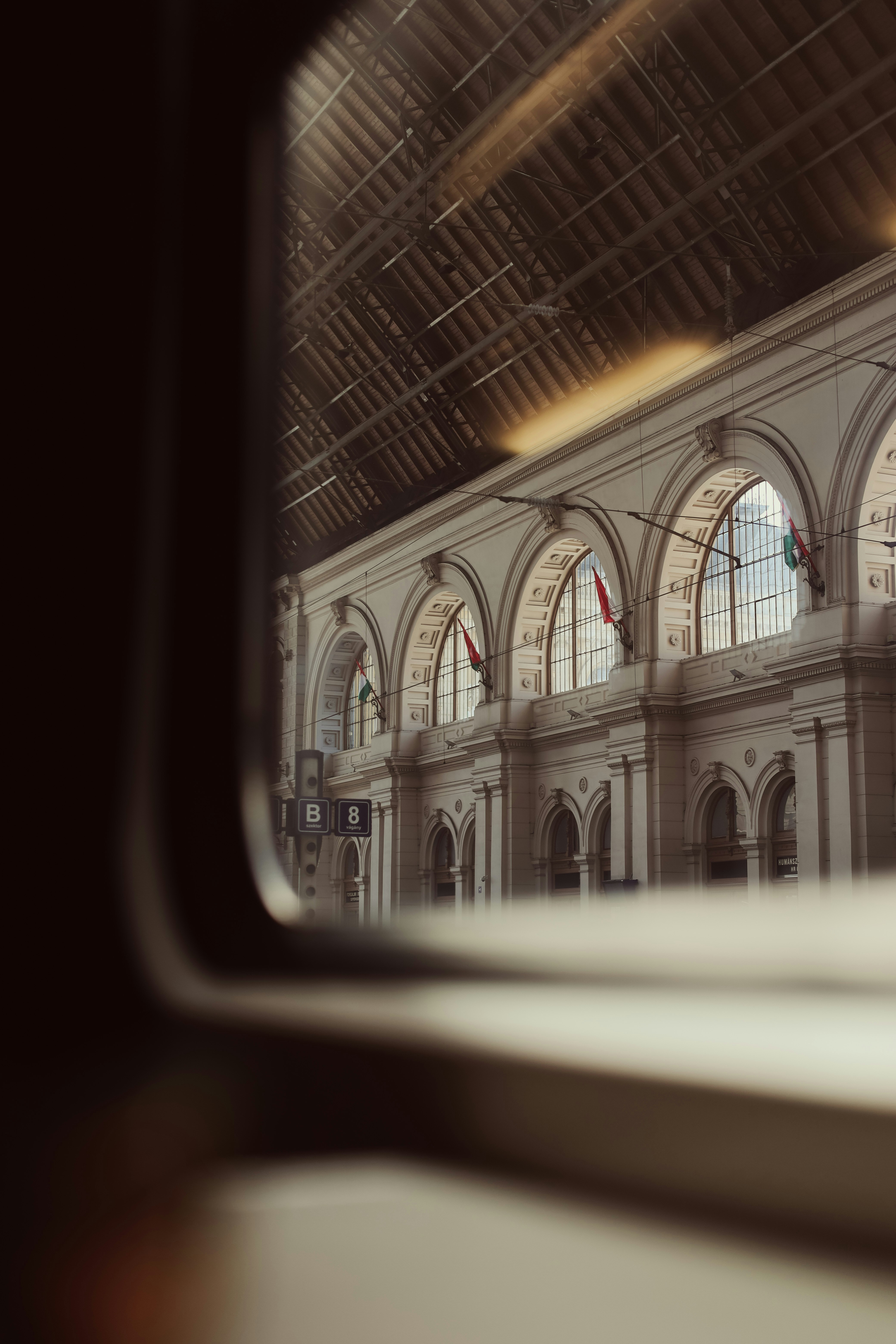 A view of a train station through a window photo – Free Hungary Image ...
