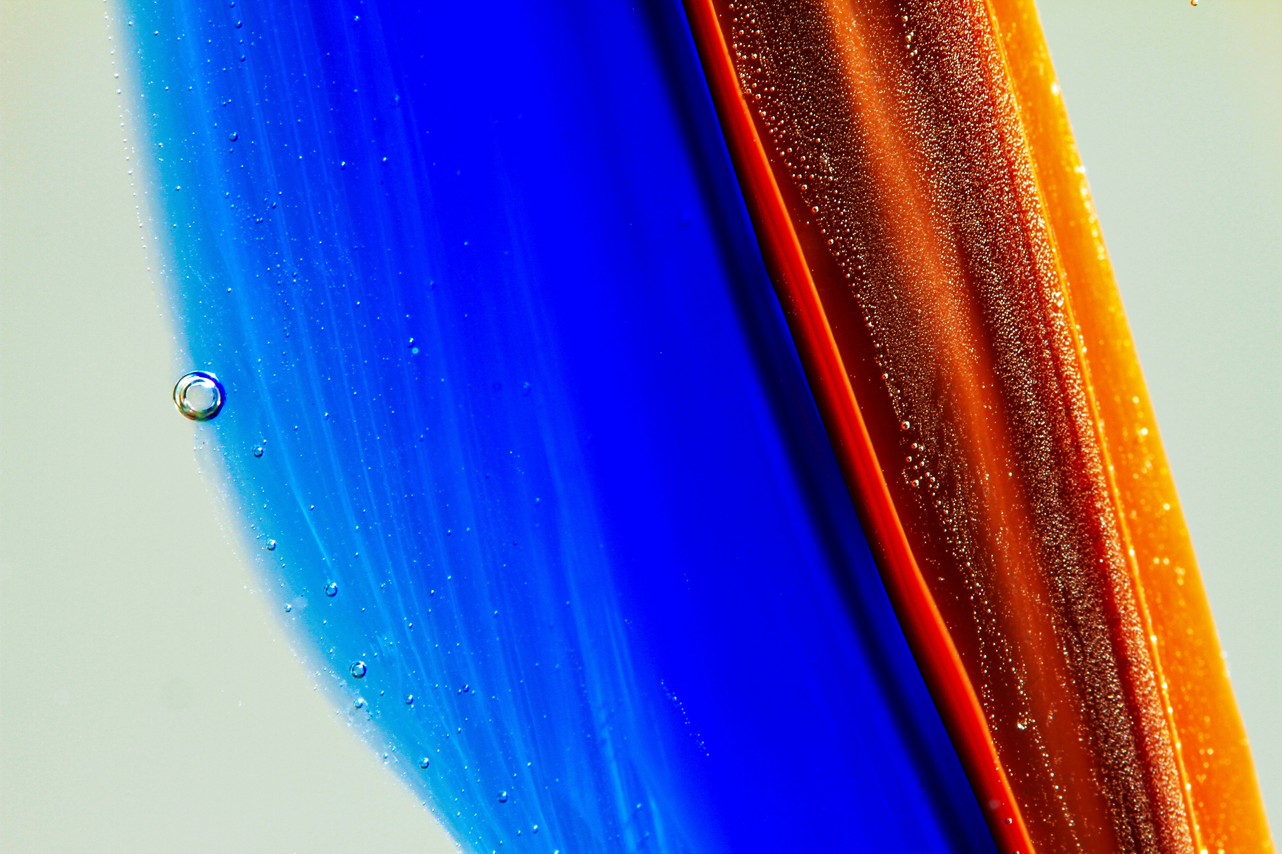 A close up of a blue and orange object photo – Free Water Image on Unsplash