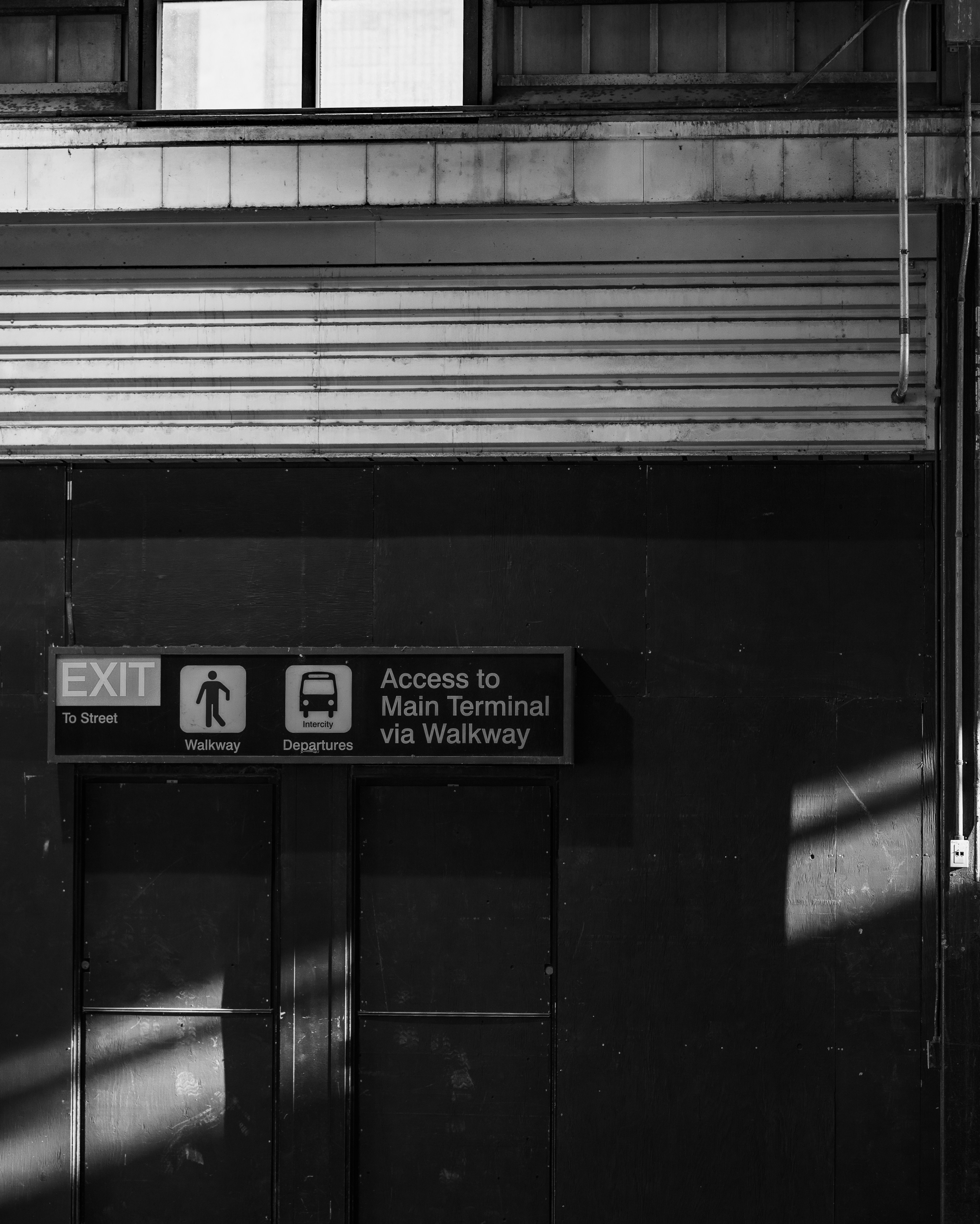 A black and white photo of an exit sign photo – Free Canada Image on ...
