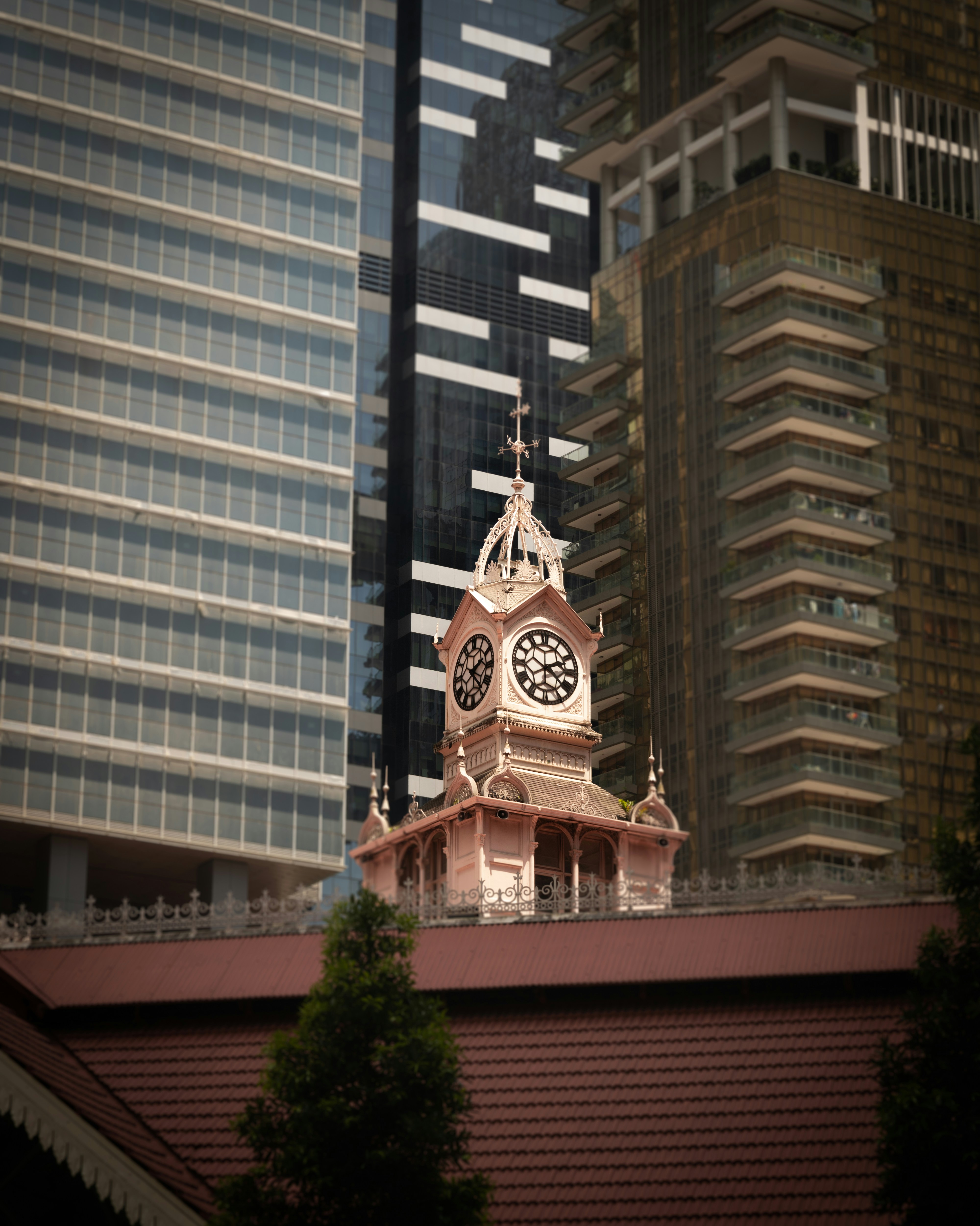 Church tower stands in the middle of skyscrapers