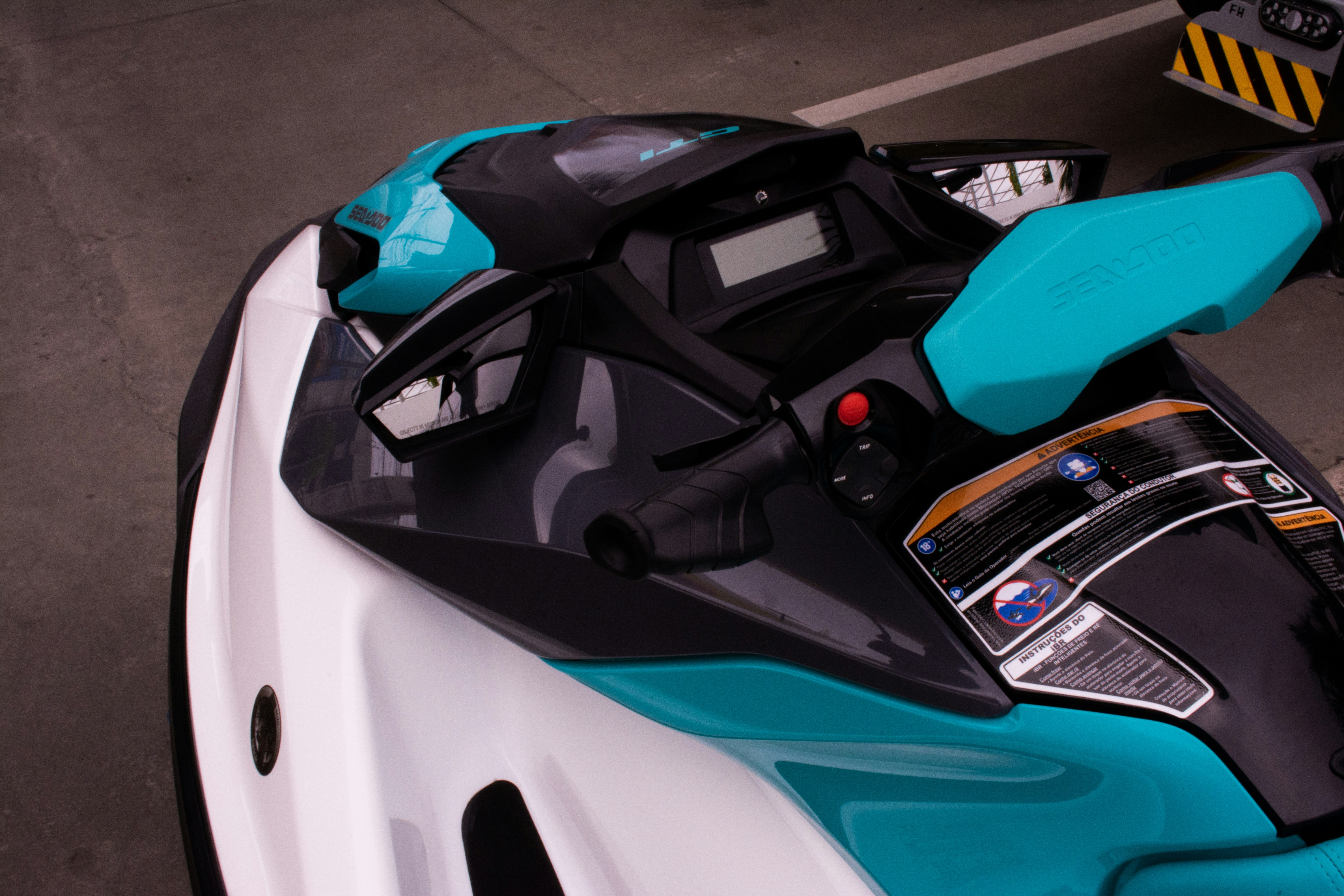 a close up of a blue and white motorcycle