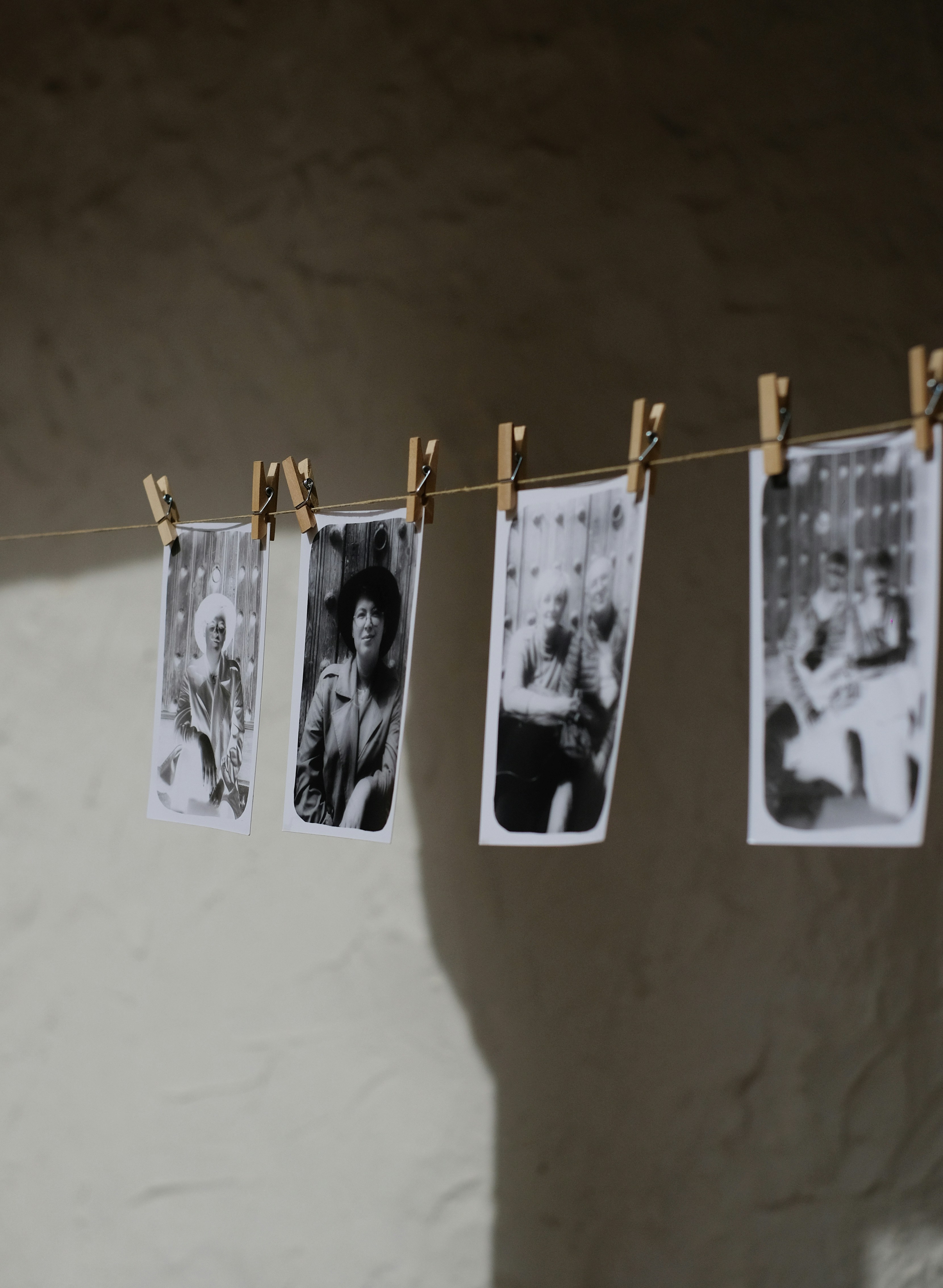 A couple of pictures hanging on a clothes line photo – Free Fujifilm ...