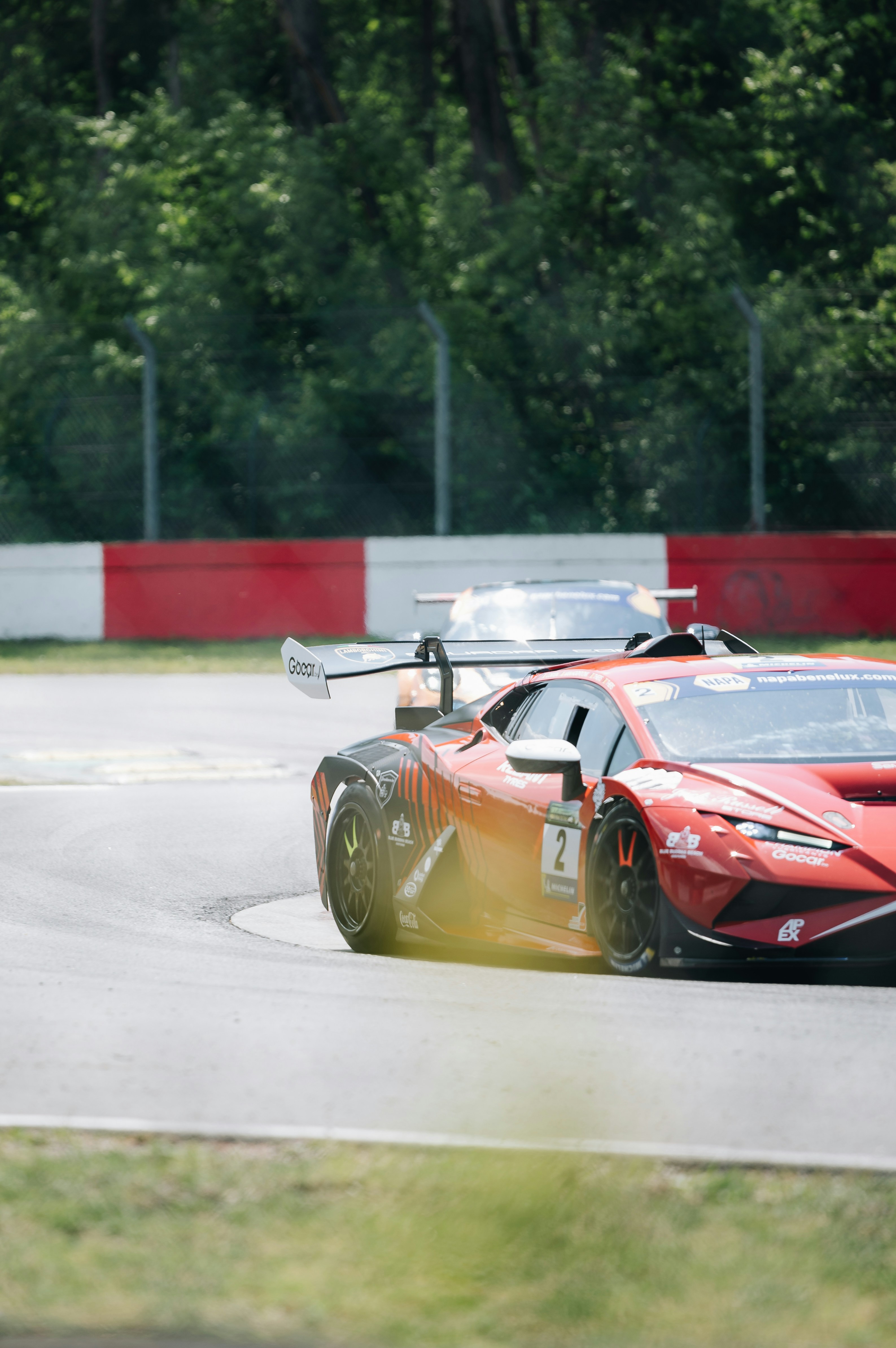 A red sports car driving on a race track photo – Free Supercar Image on ...