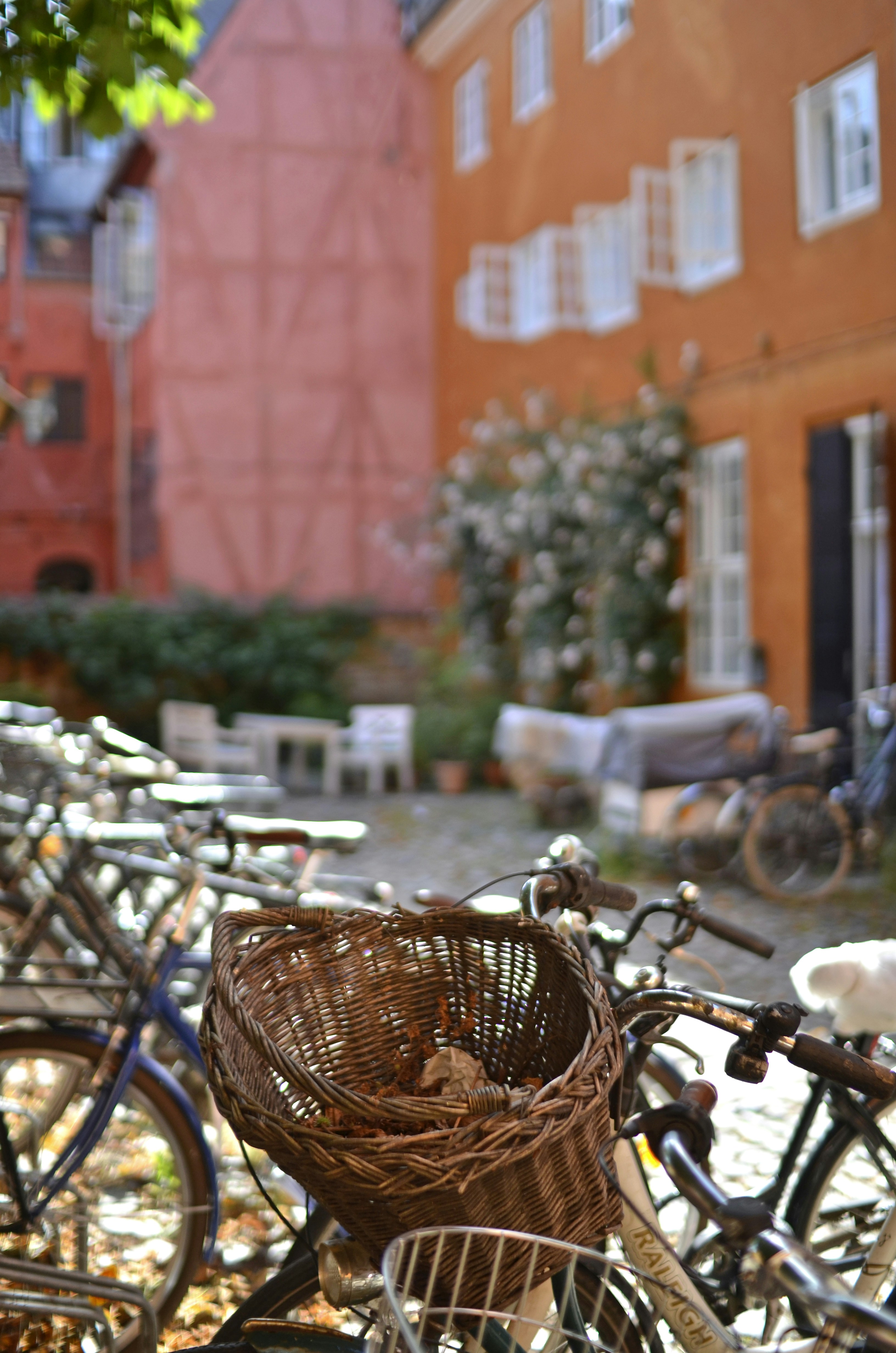 Wicker Basket in a Sunlit Bicycle Courtyard
