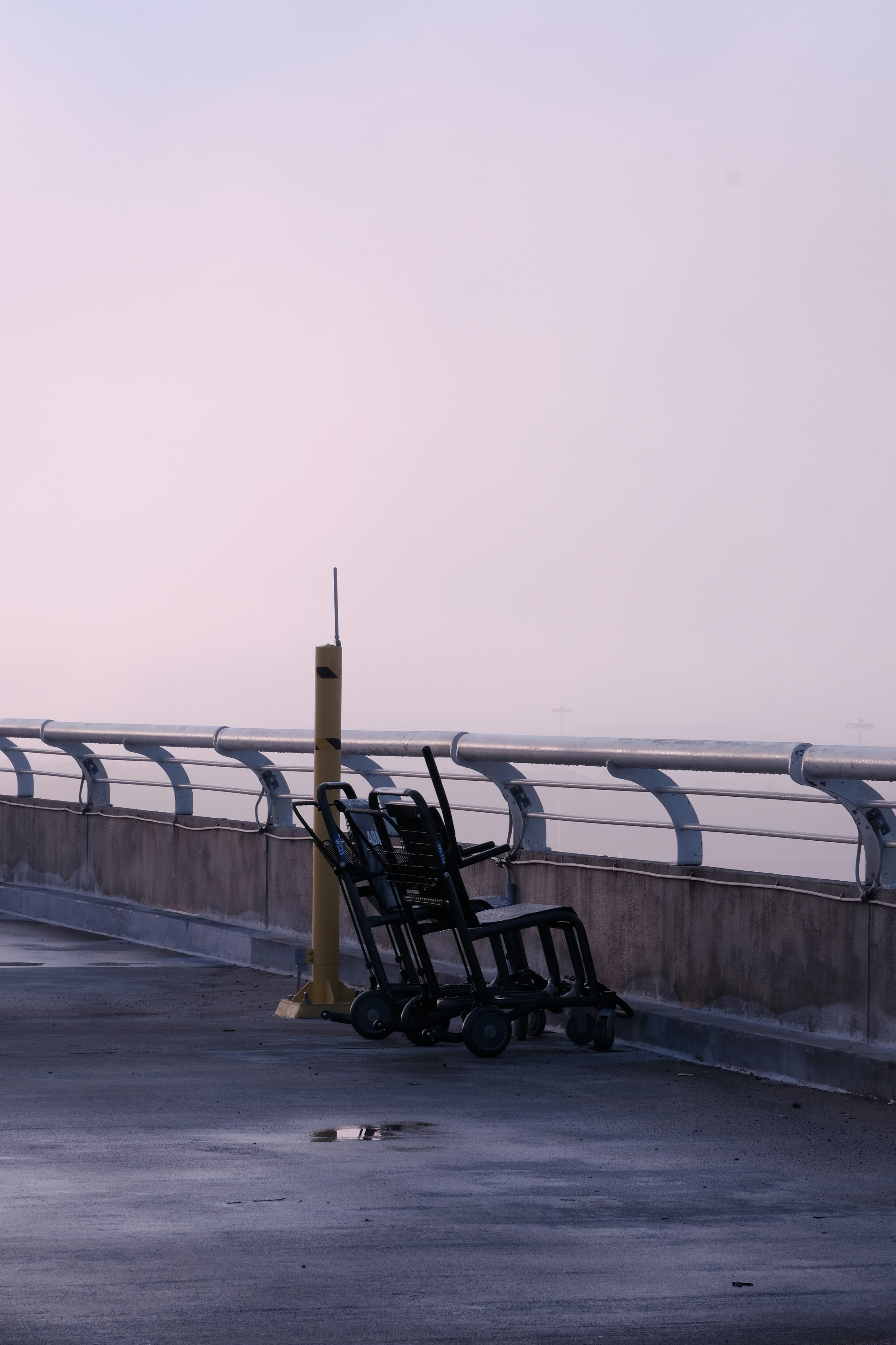 A pile of luggage sitting on the side of a road photo – Free Orlando ...