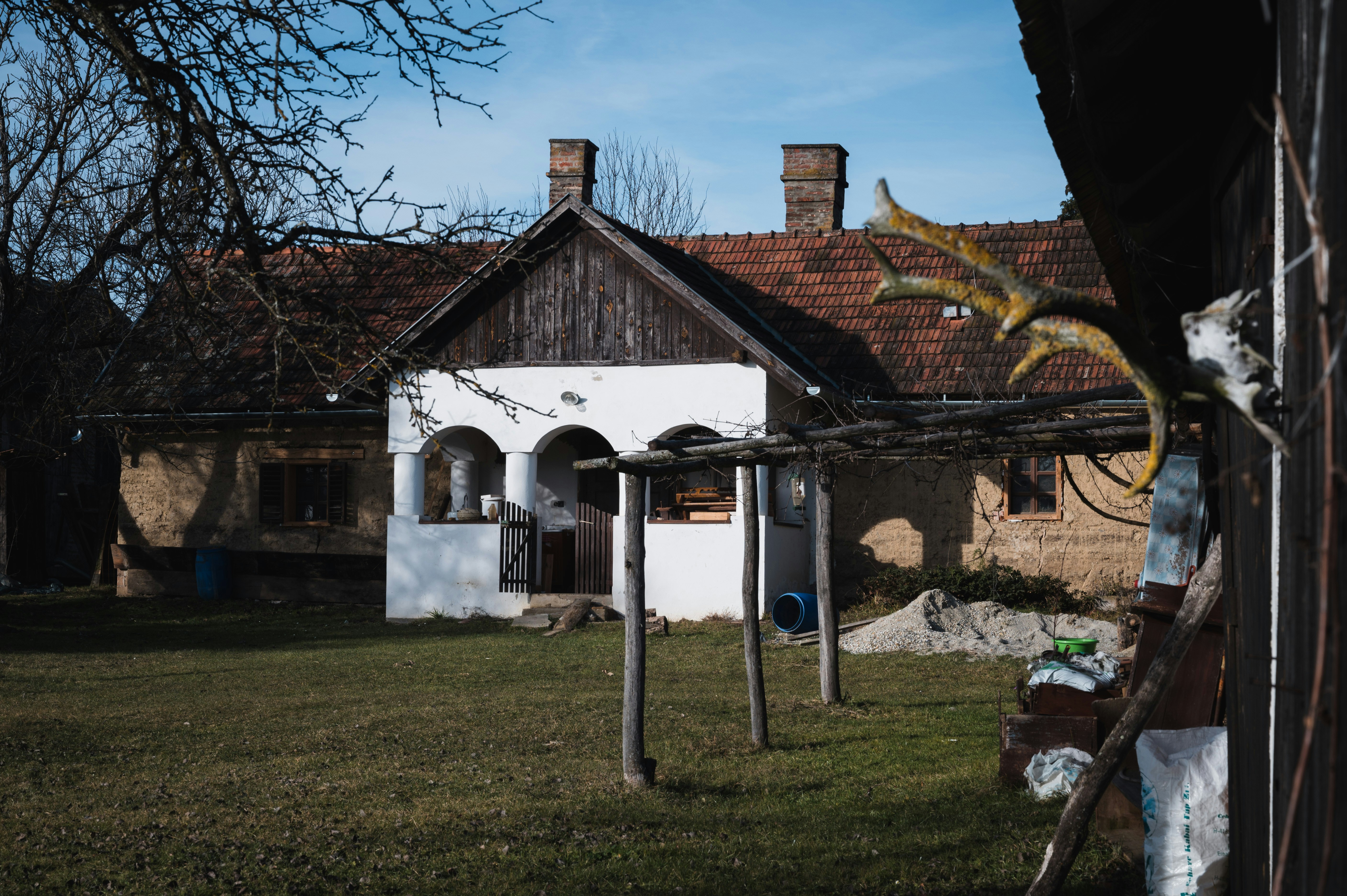Abandoned Yardkeeper: A Quiet House Under a Clear Blue Sky