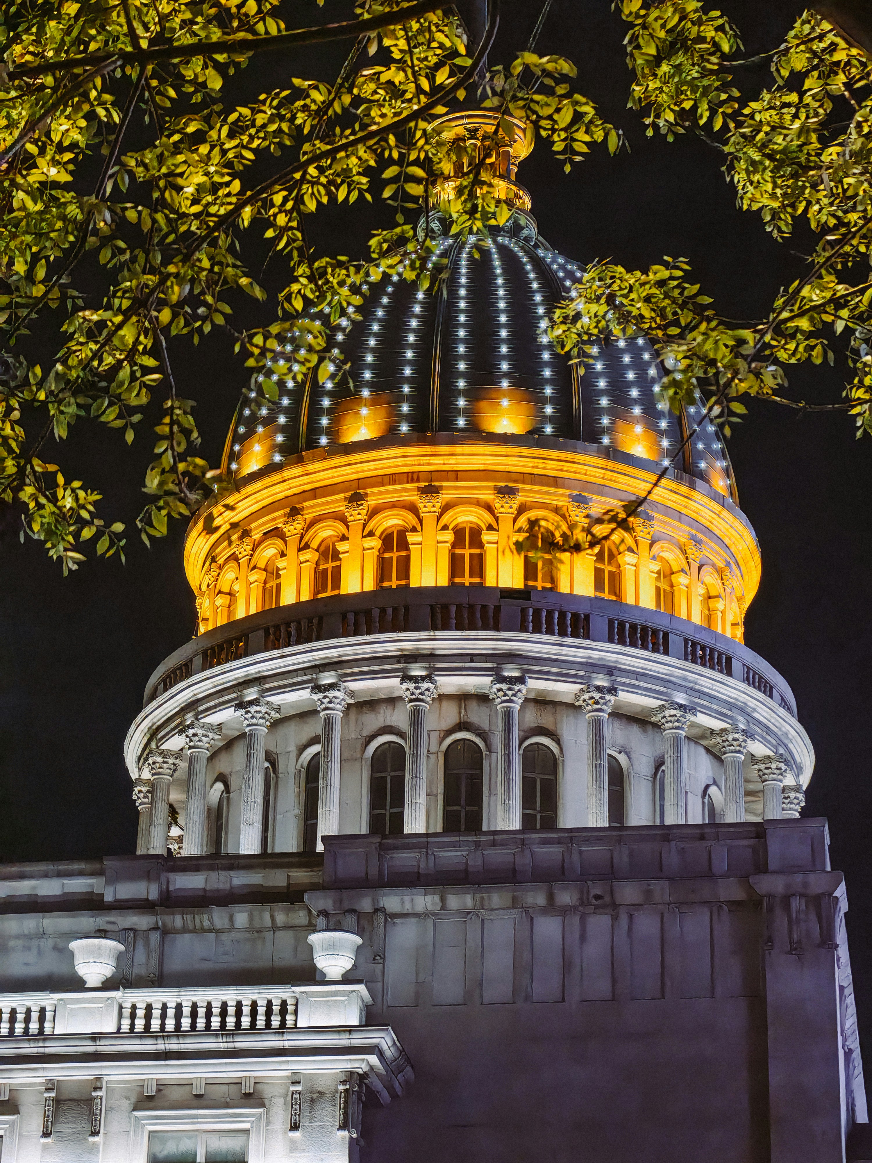 The dome of a building lit up at night photo – Free Build Image on Unsplash
