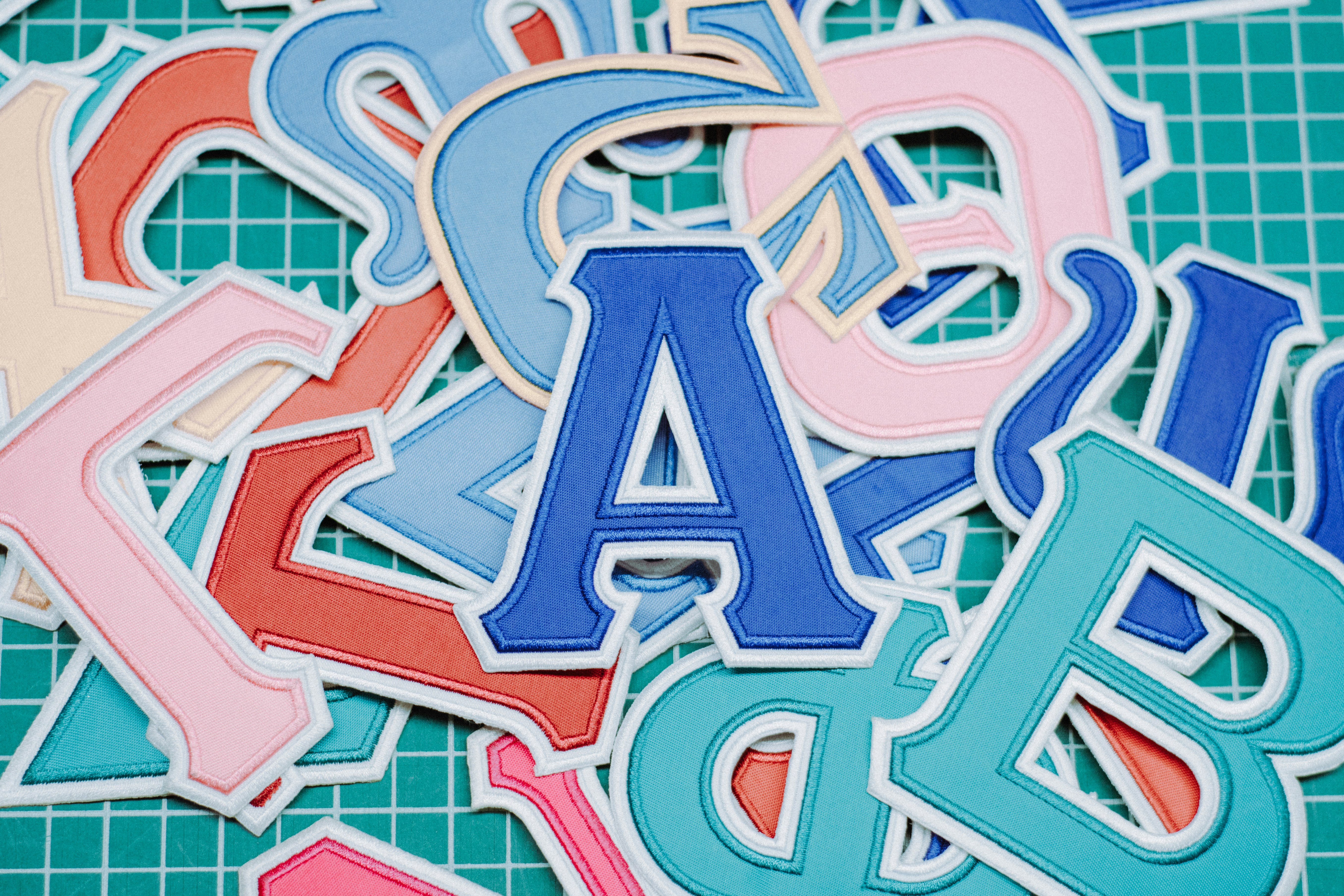 A pile of cut out letters sitting on top of a table photo – Free Los ...