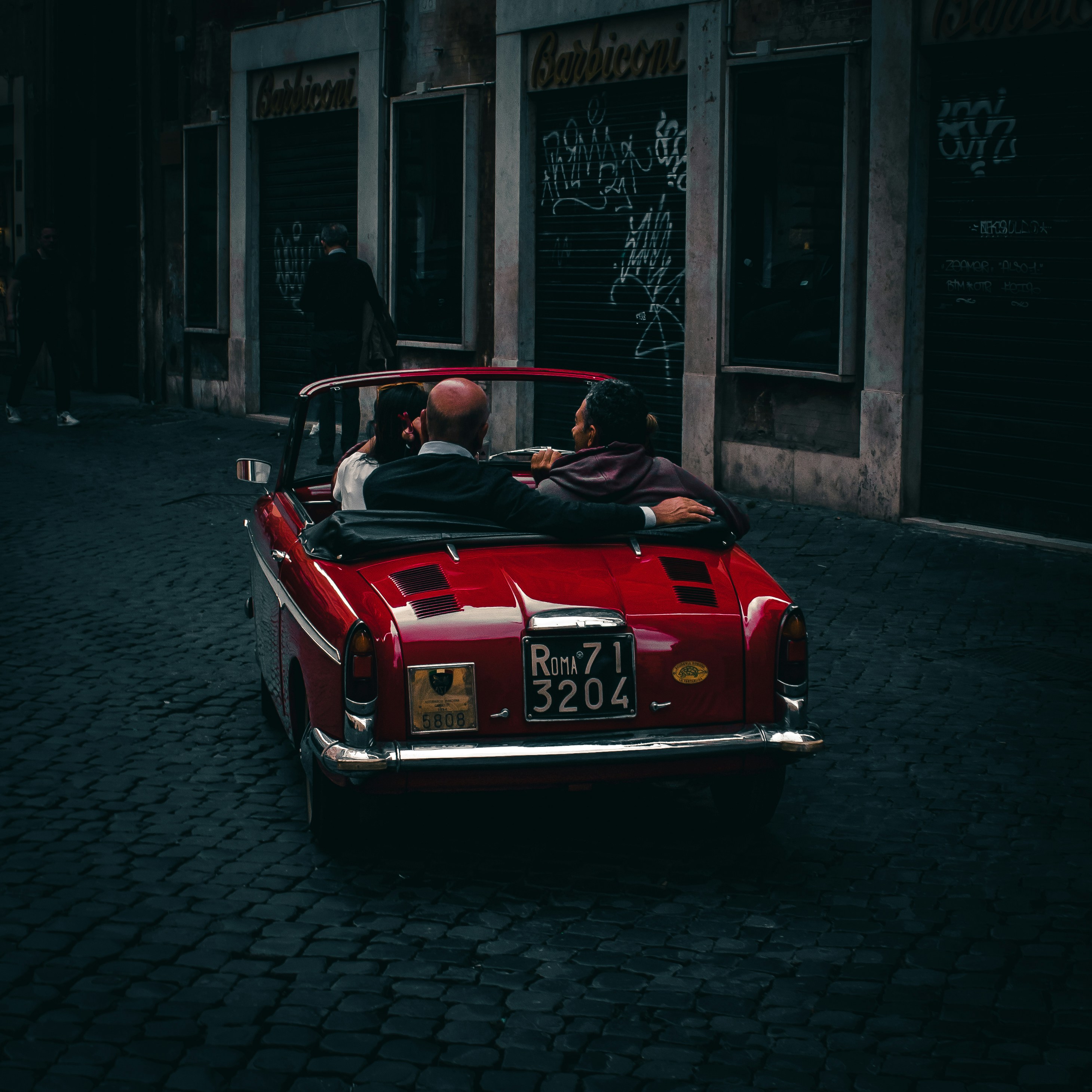 Crimson Convertible in a Graffiti-Glow Alley