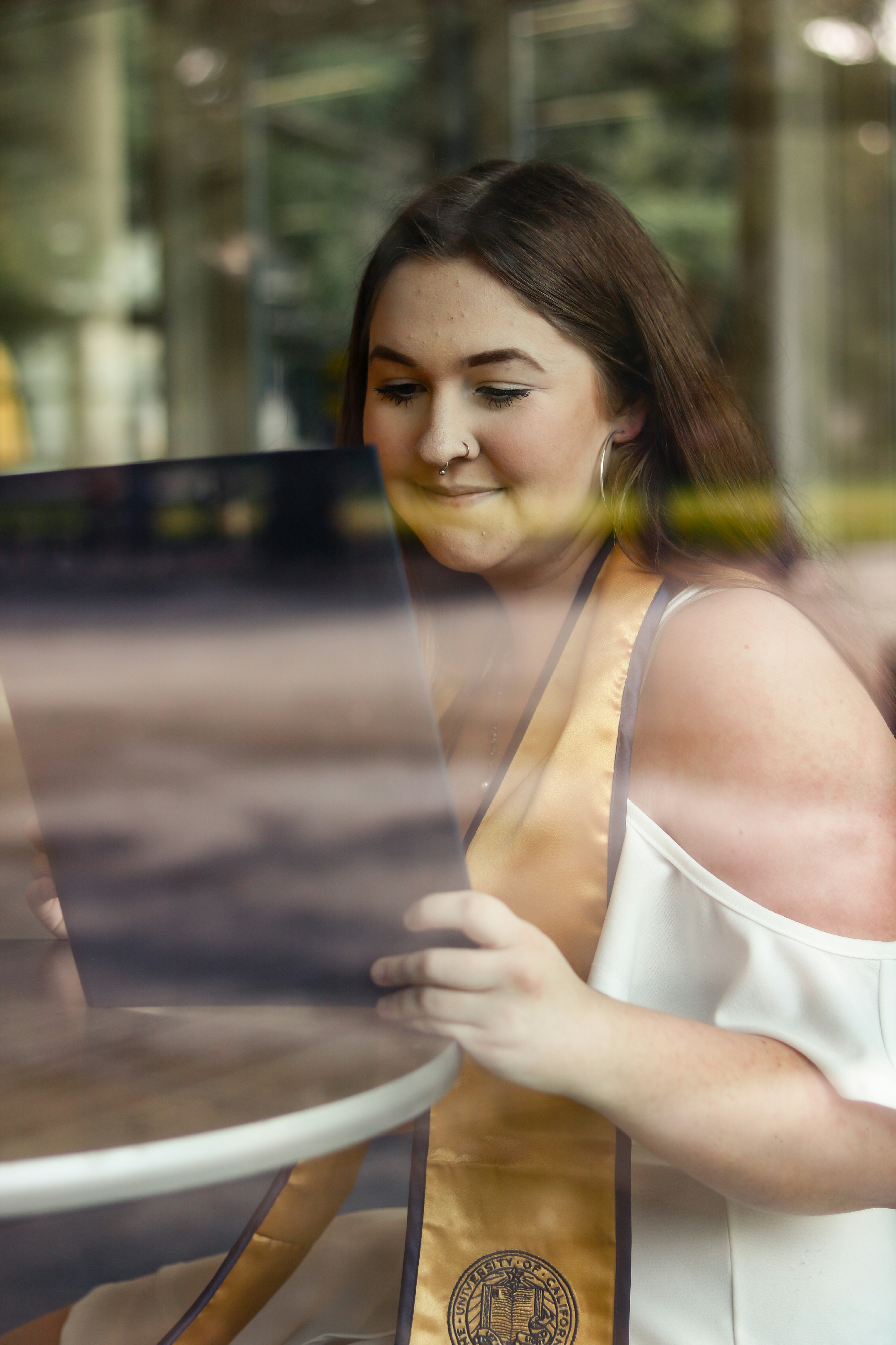 A woman looking through a window at something photo – Free Portrait ...