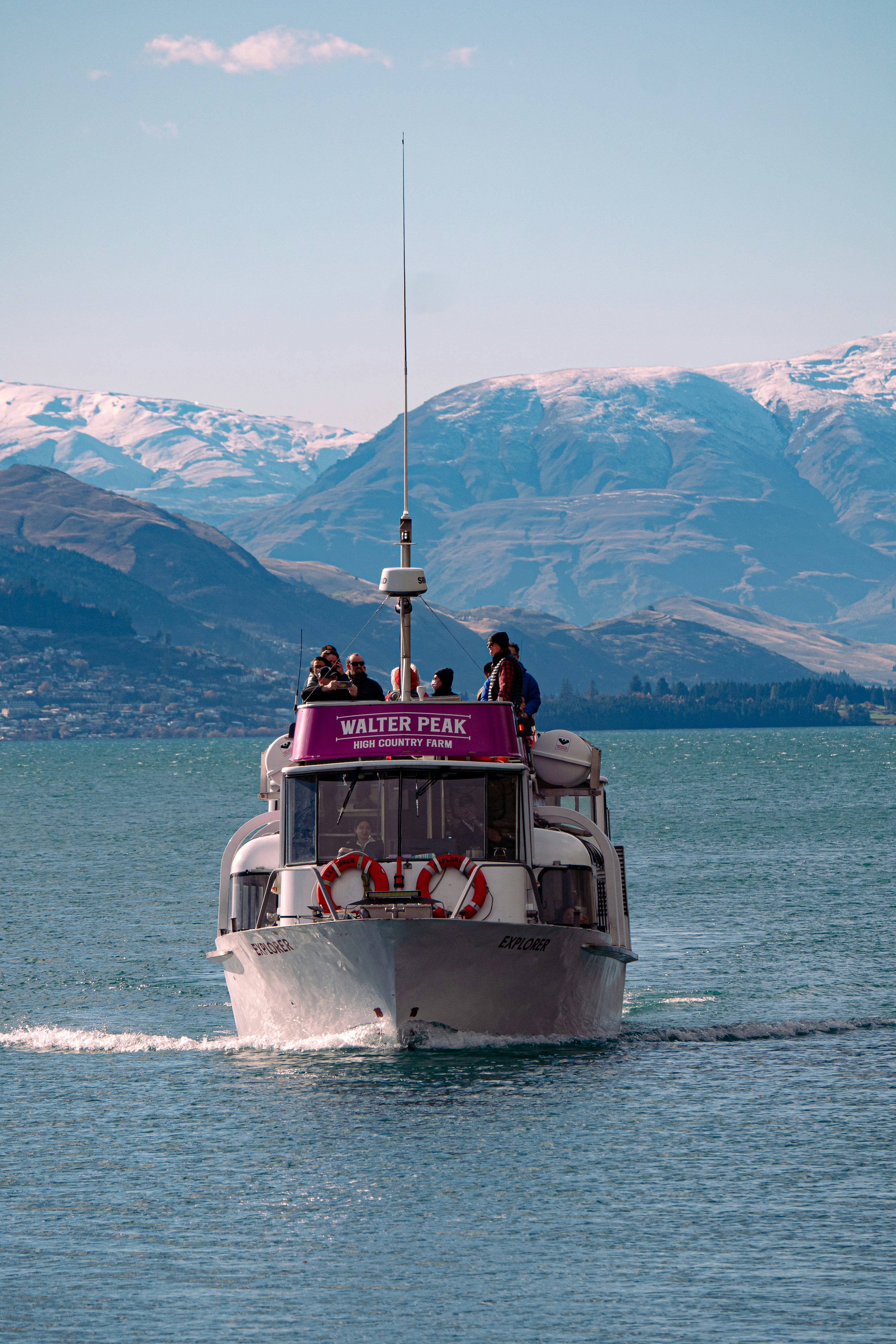 Walter Peak Ferry Slices Through a Sapphire Lake Beneath Snow-kissed Peaks