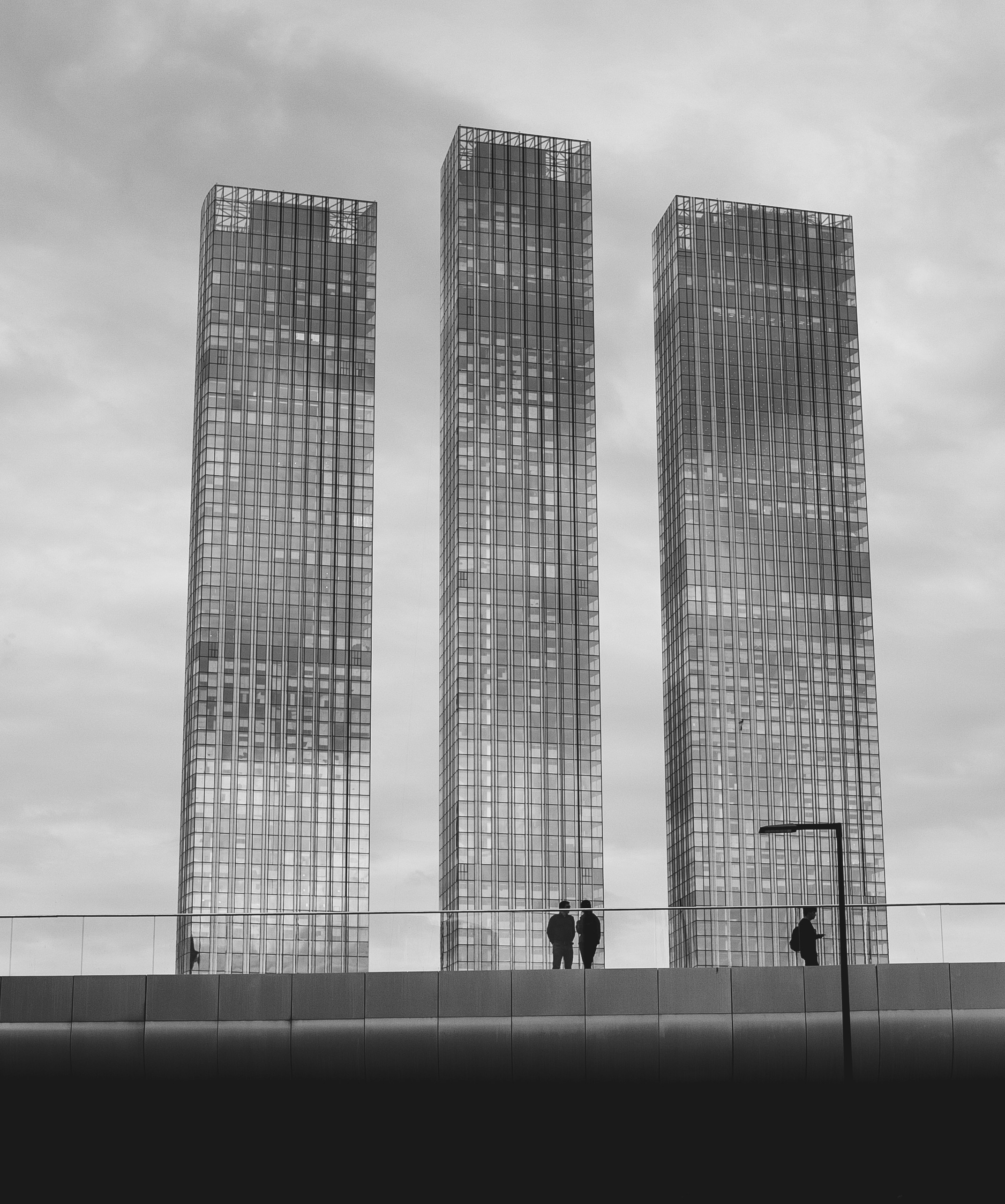 Three Glass Giants Framed by a Quiet Sky