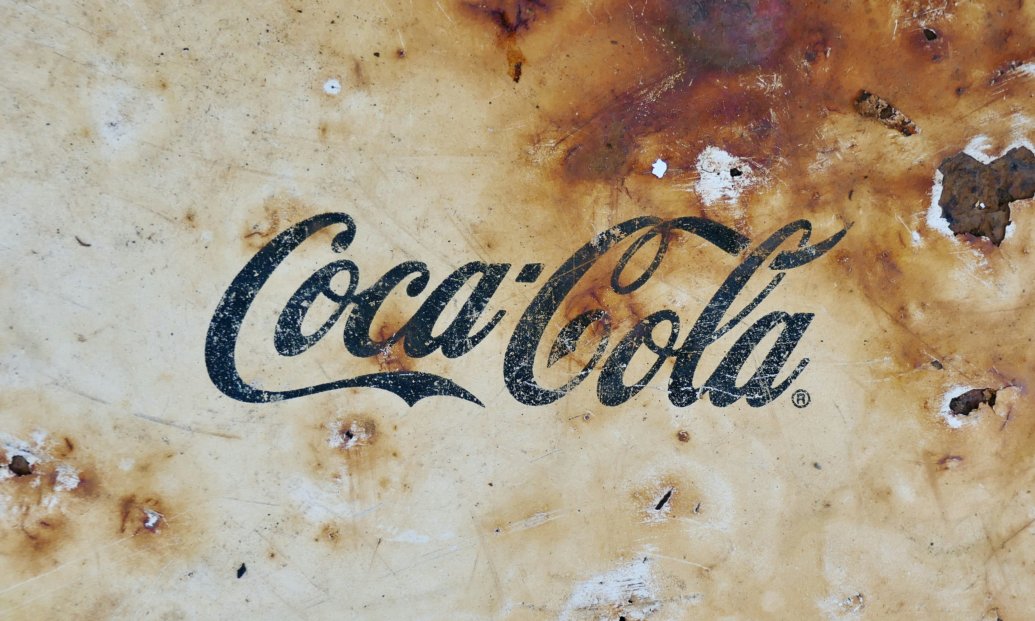 A close up of a coca cola sign on a wall photo – Free Rust Image on ...