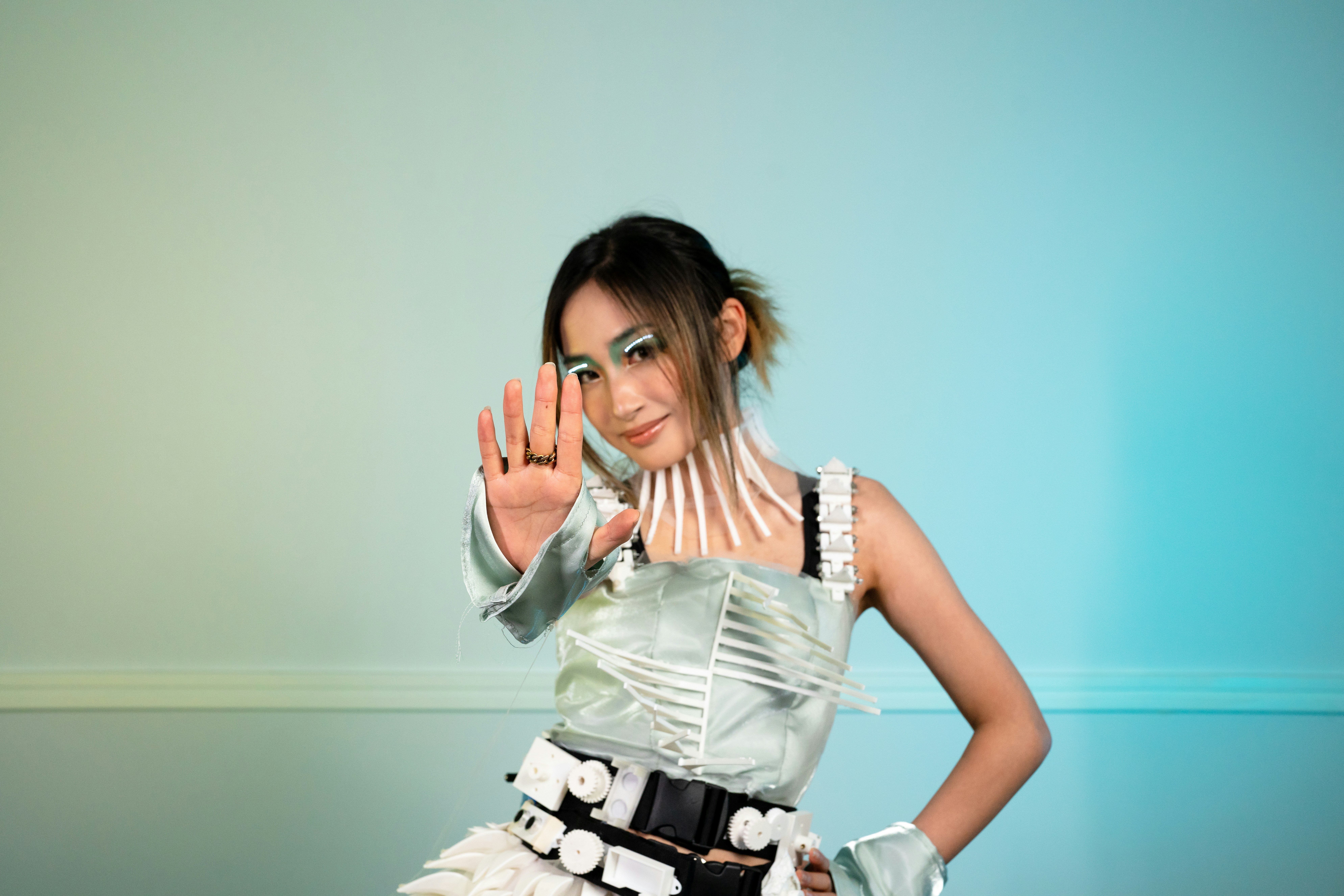Glimmer of Steel: Hands Raised in Neon Grace