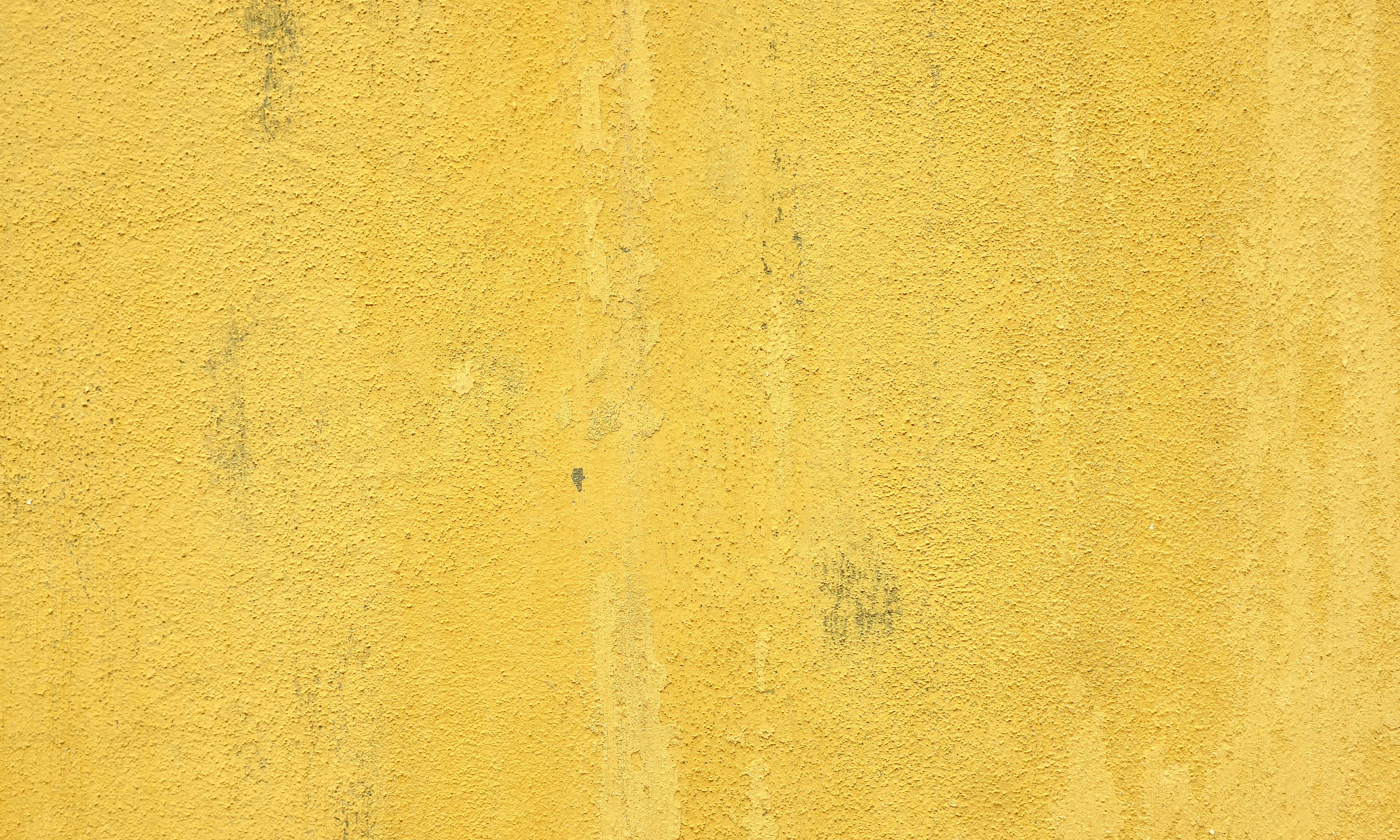 A close up of a yellow painted wall photo – Free Yellow Image on Unsplash